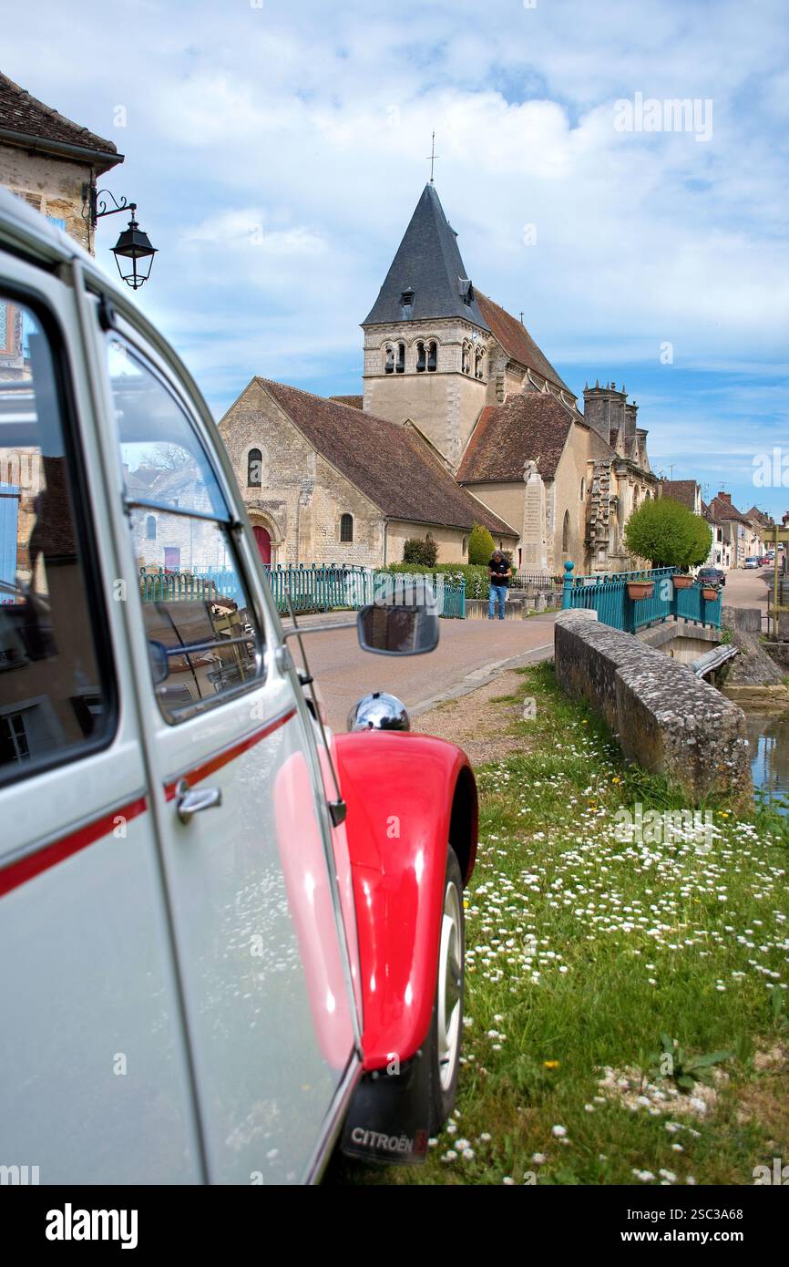 Saint-Pierre et Saint-Paul in Ligny-le-Châtel with cult car 2cv Stock ...