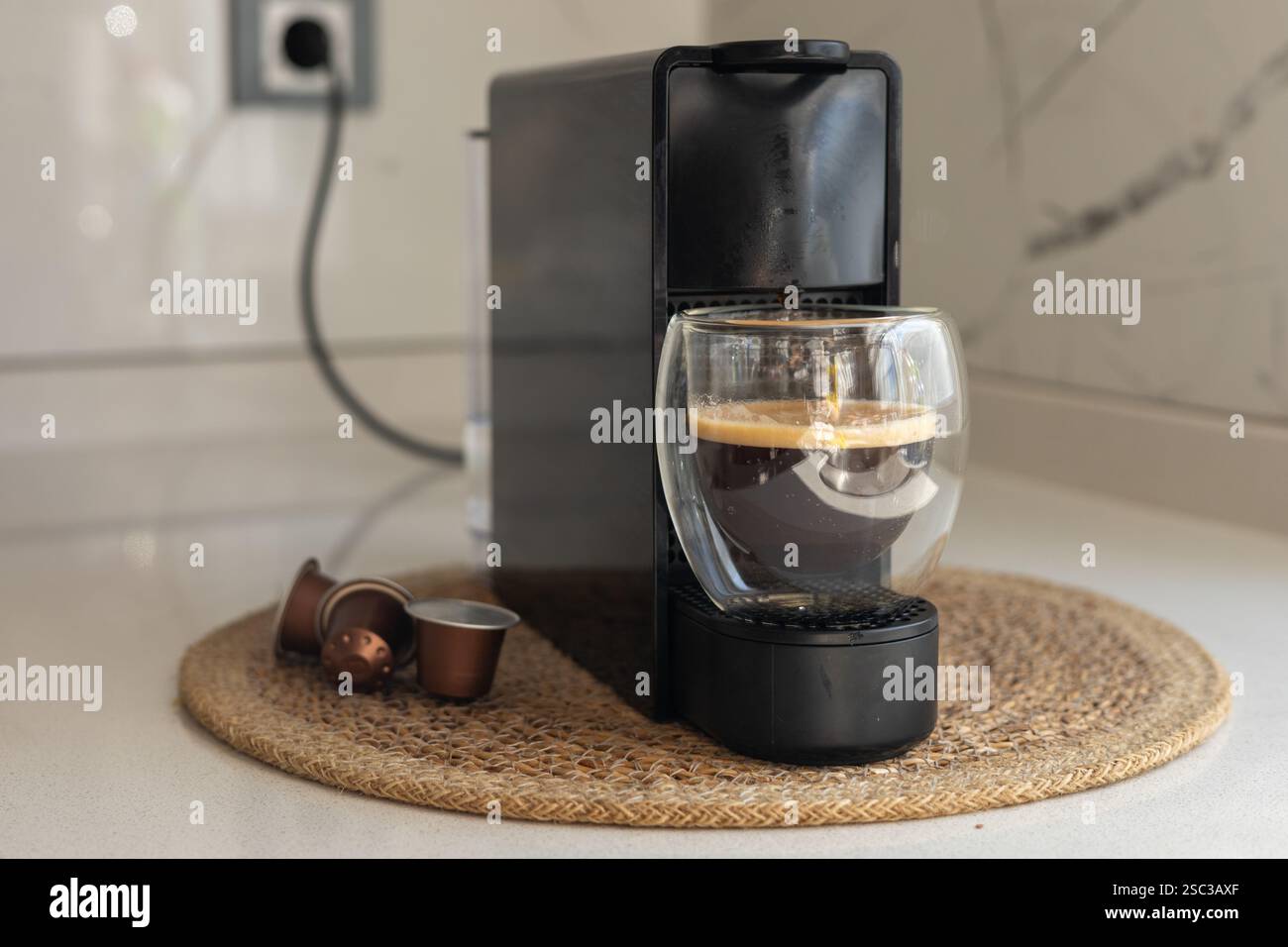 Coffee brewing process in a modern kitchen with a stylish machine and ...