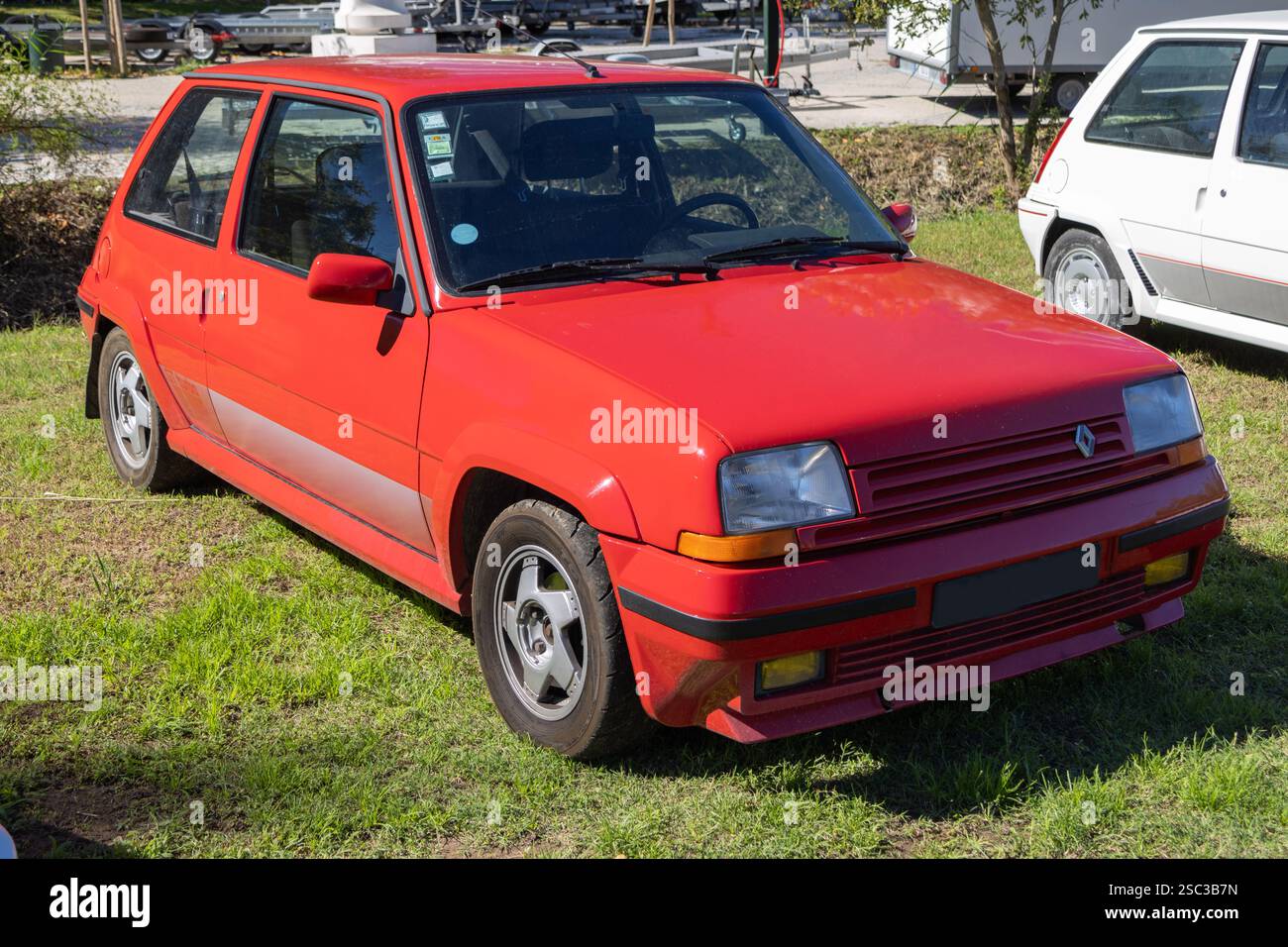 Classic red renault 5 gt turbo parked on a grassy area, enjoying a ...