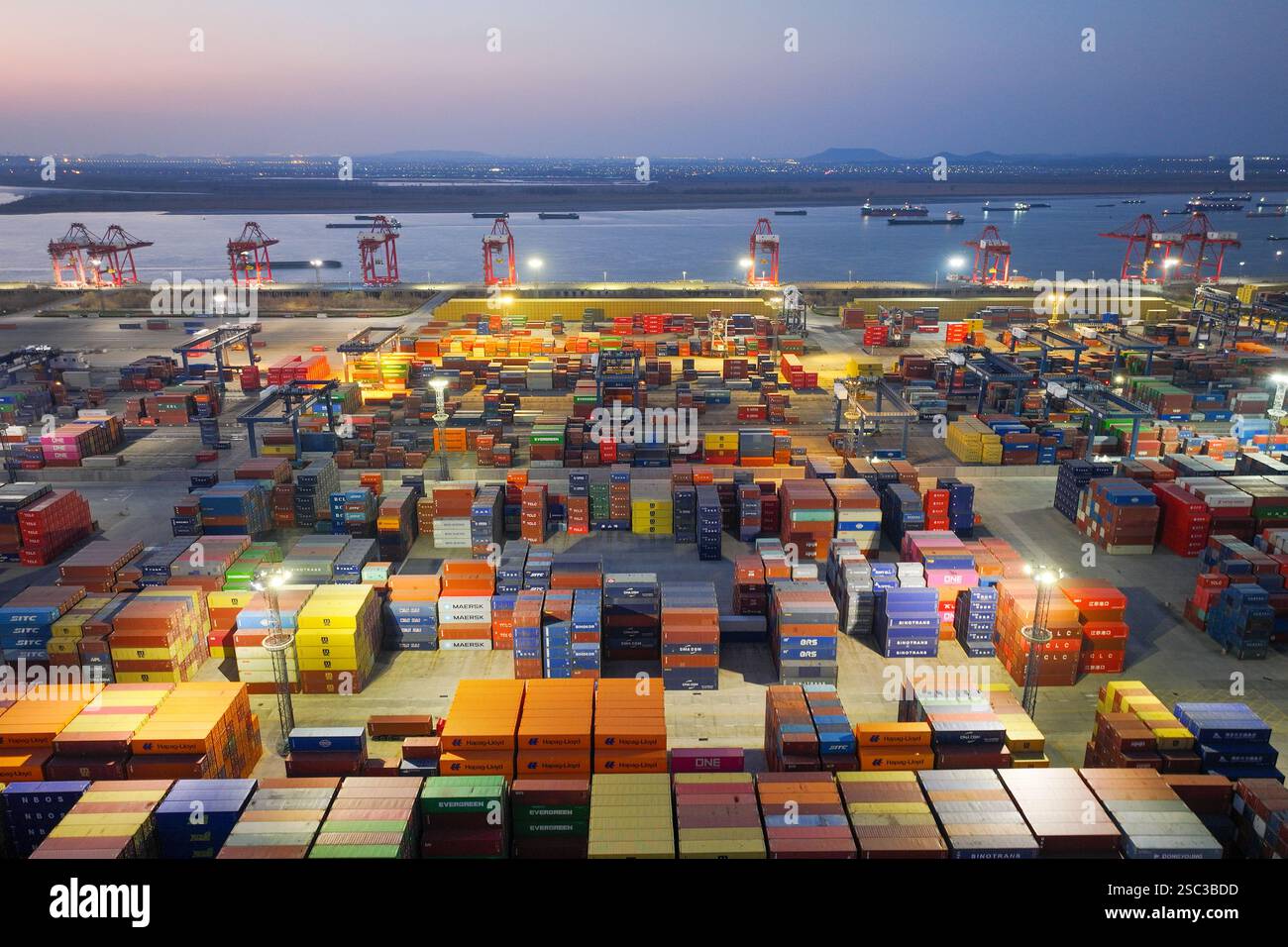 NANJING, CHINA - FEBRUARY 5, 2025 - Trucks transport containers at the ...