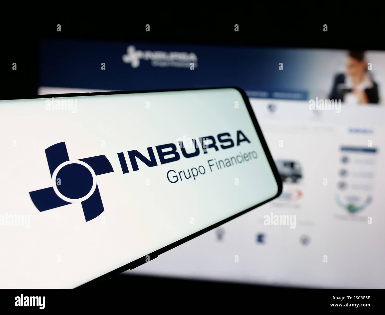 In this photo illustration, a mobile phone with the logo of company Grupo Financiero Inbursa S.A ...
