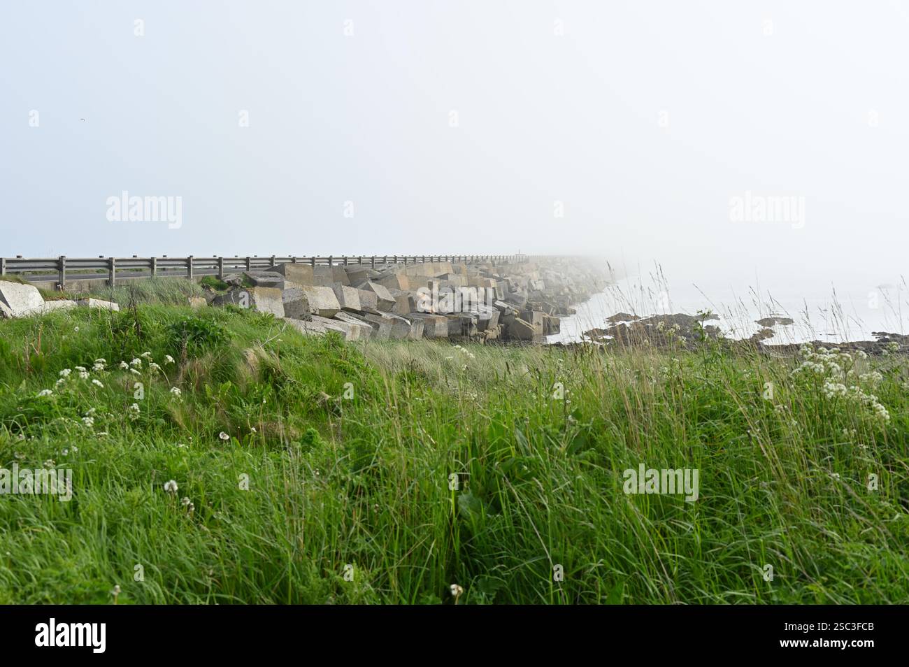 Churchill Barrier causeway on Orkney, disappearing into the fog Stock ...