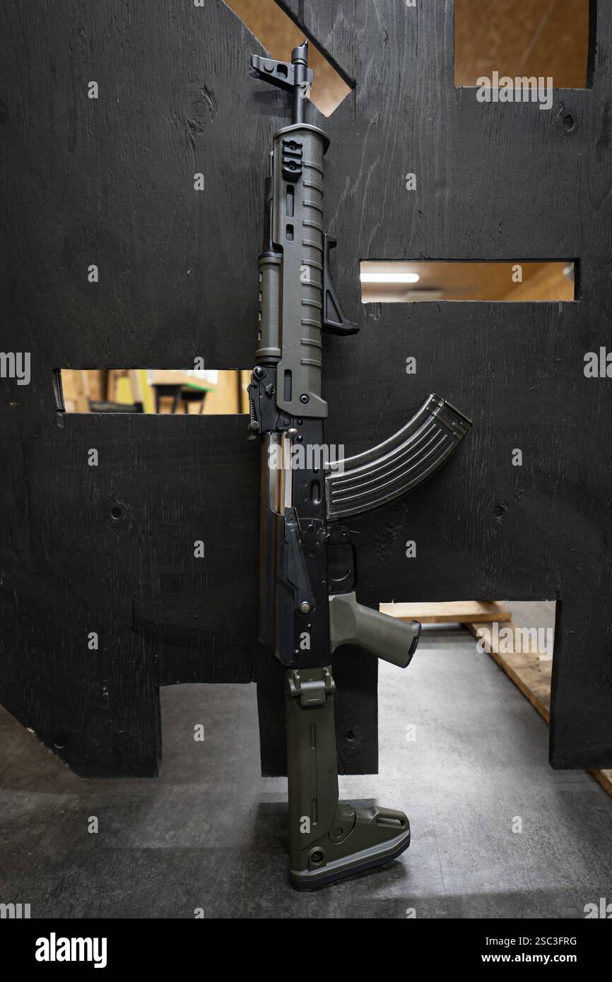 Tactical AK carbine rifle in a shooting range. Vertical photo Stock ...