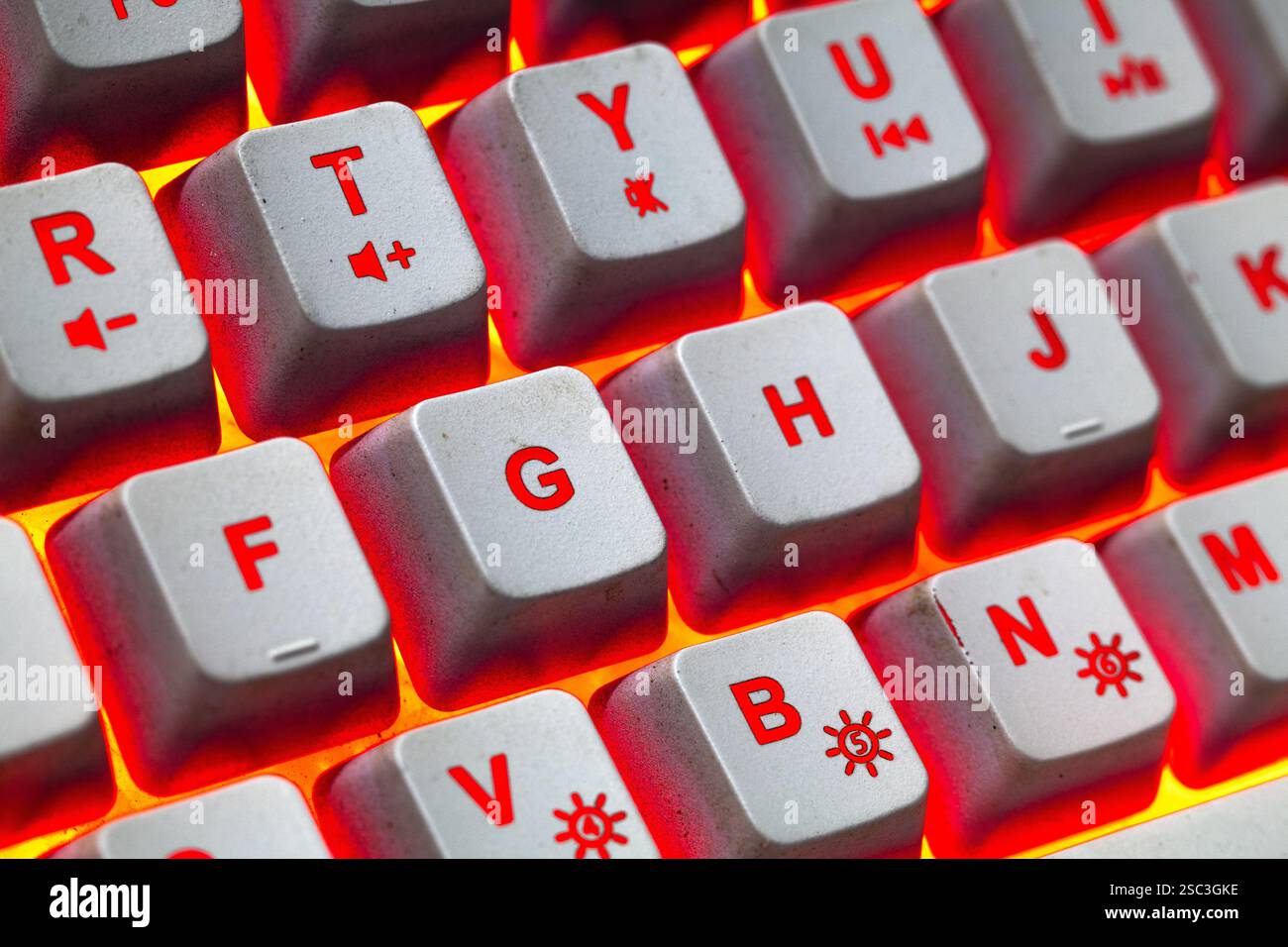 Macro photo of keyboard keys with red yellow bright background rgb ...