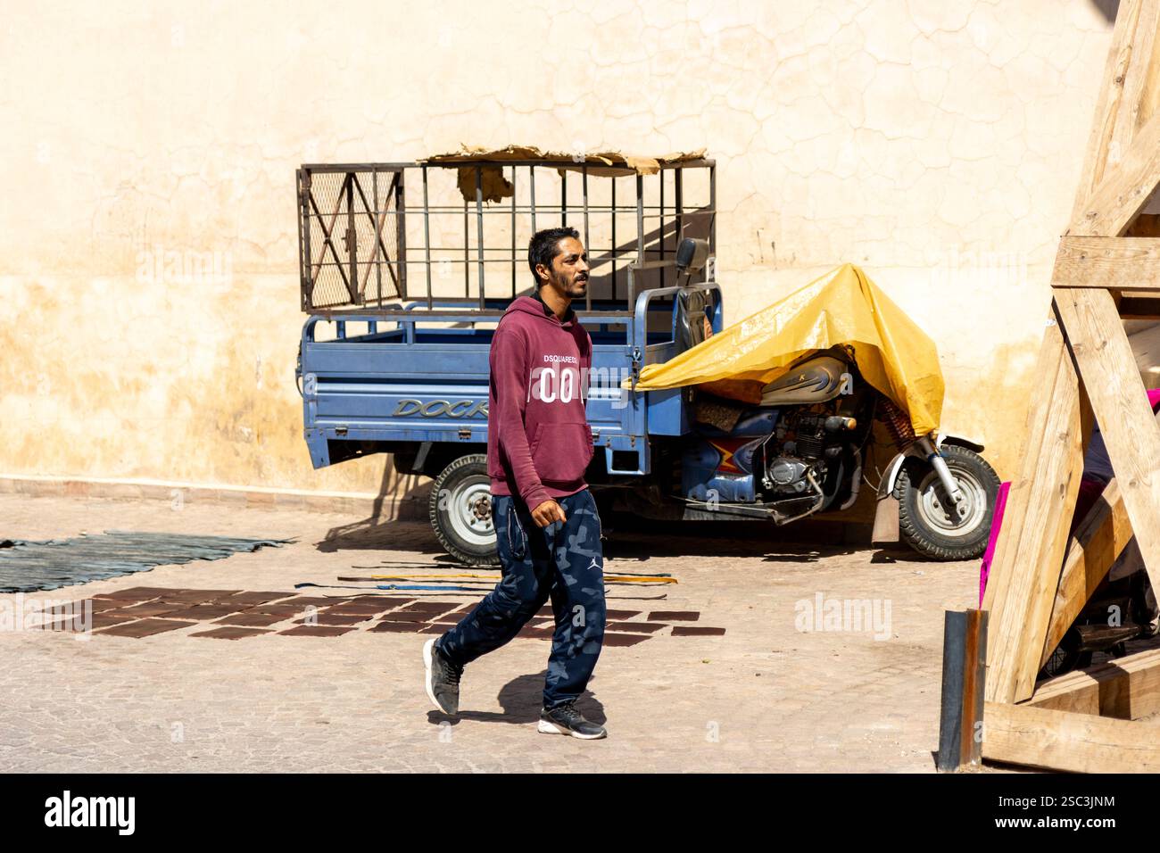 Marrakech Medina street life, local walking in the medina. Three ...