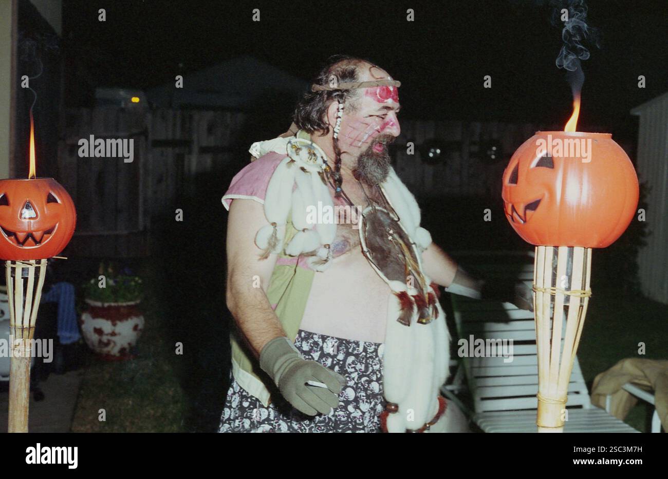 Adults wearing costumes at a Halloween party in the U.S.A. approx. 1994 ...