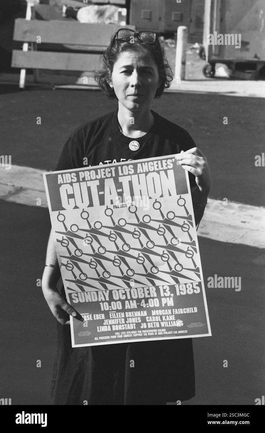 Los Angeles, CA, USA, 1985. Woman holding a poster advertising a Cut-a ...