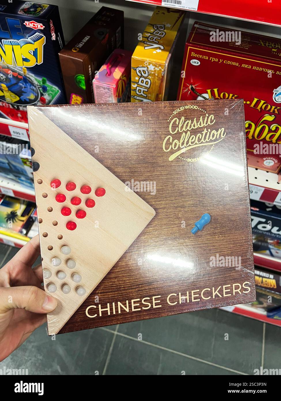 Kyiv, Ukraine - February 04, 2025: Close-up of a Chinese checkers box ...