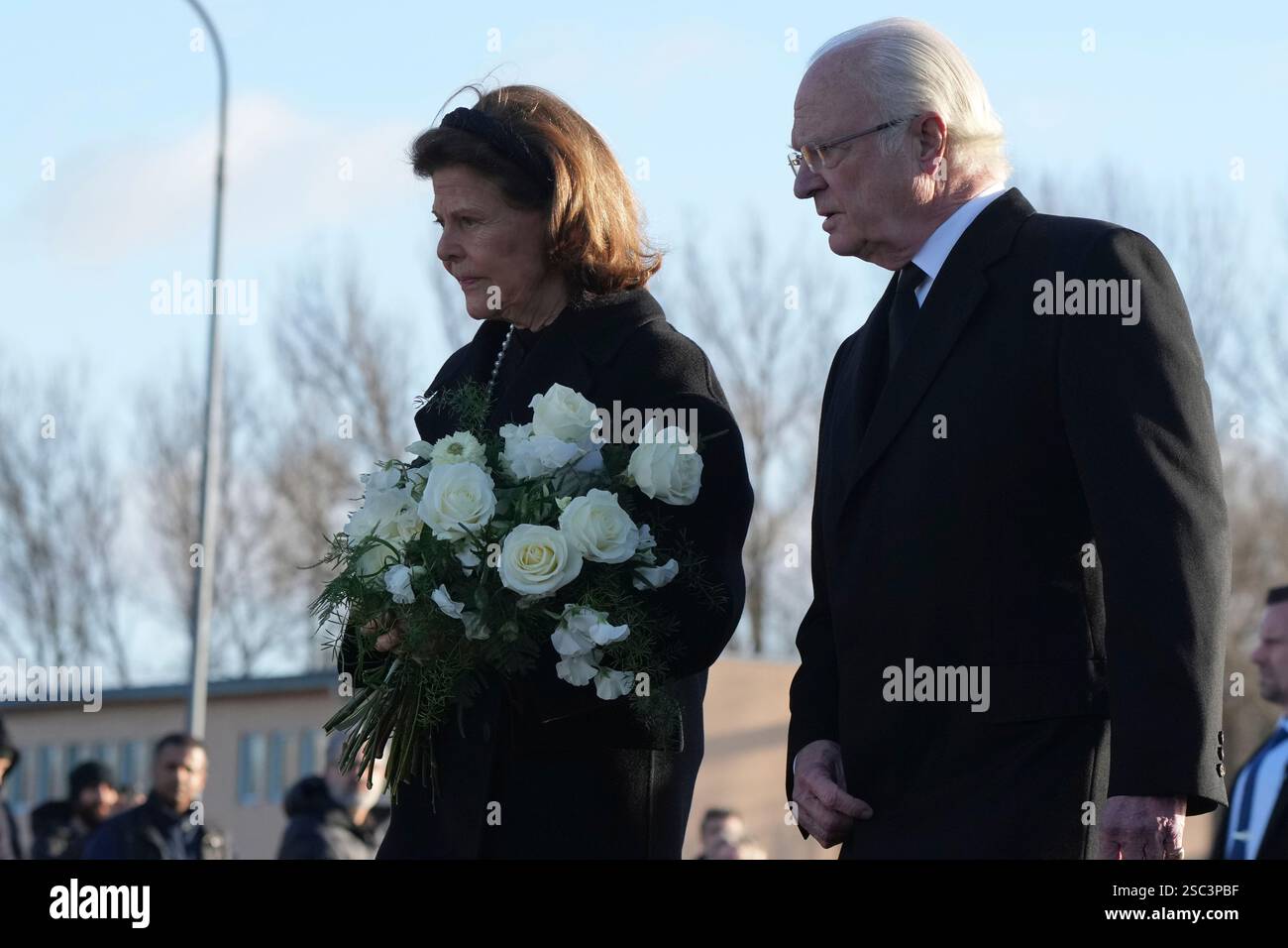 Sweden's King Carl XVI Gustaf and Queen Silvia arrive to place flowers ...