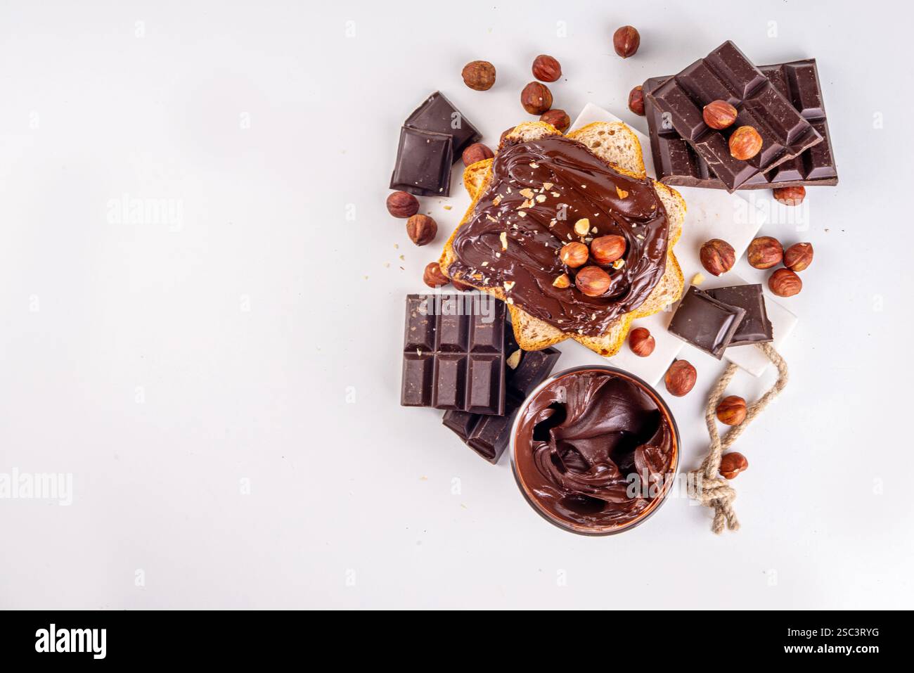Bread with chocolate hazelnuts paste cream. Traditional american European sweet breakfast dope ...