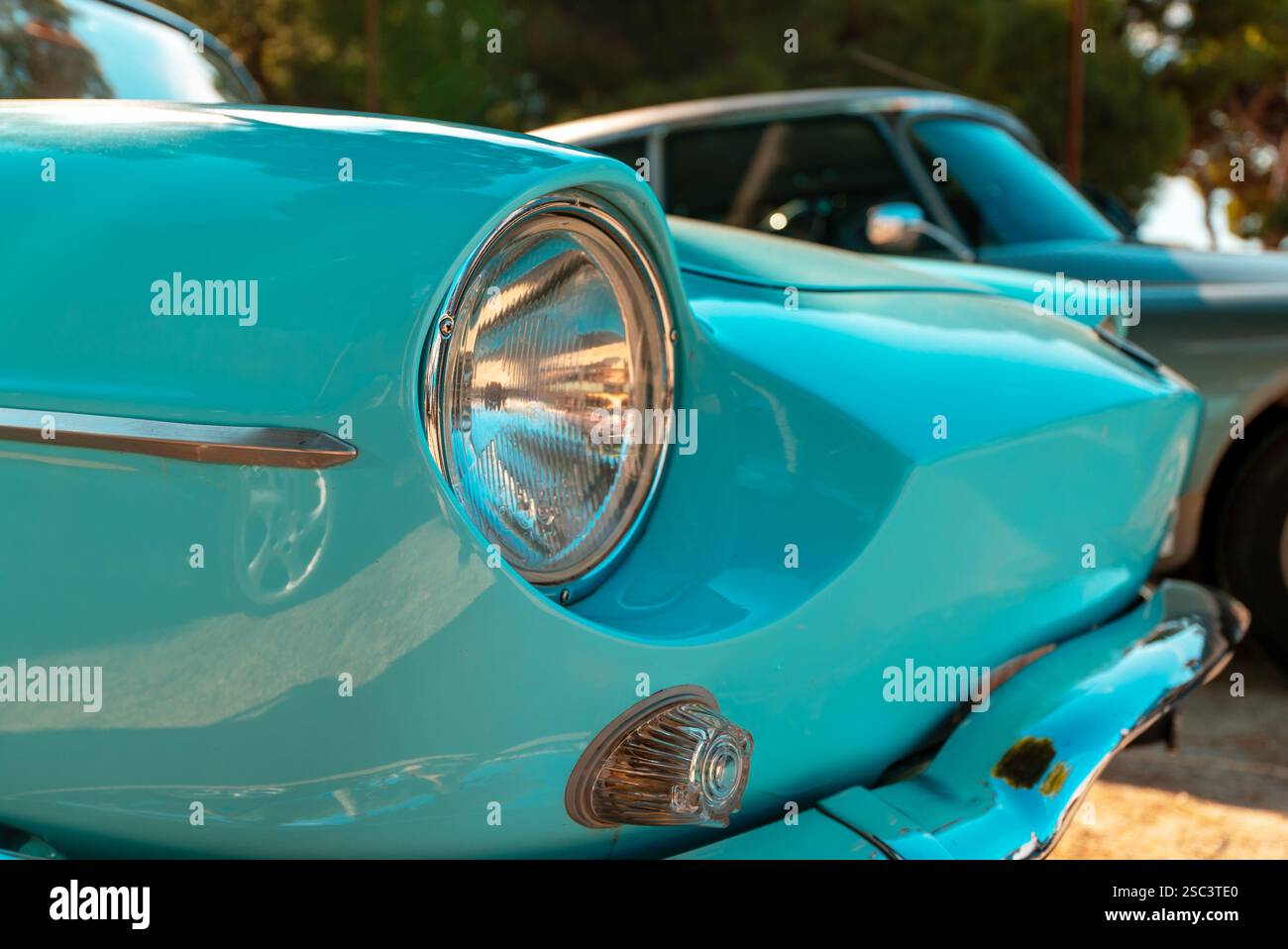 Classic turquoise car with shiny headlight and chrome details Stock ...