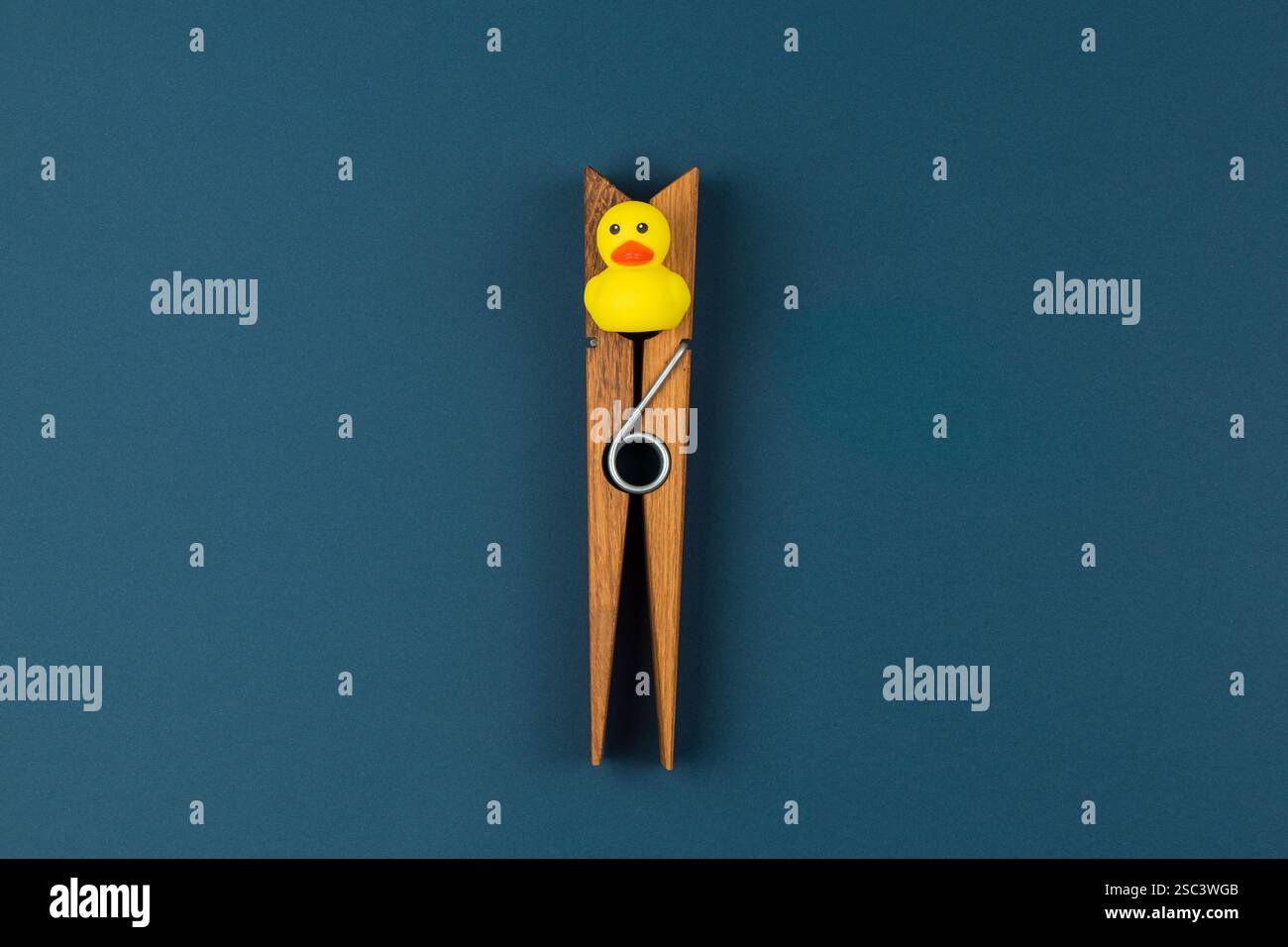 Wooden clothespin and rubber duck signify looming crisis, stuck feeling ...