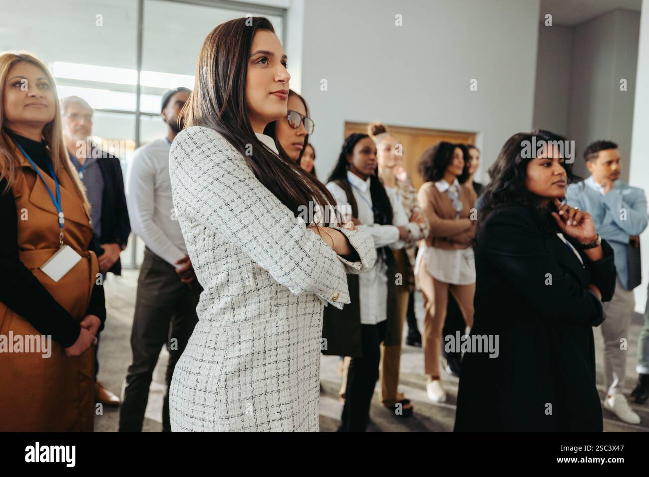 Diverse group attentively listens hi-res stock photography and images ...