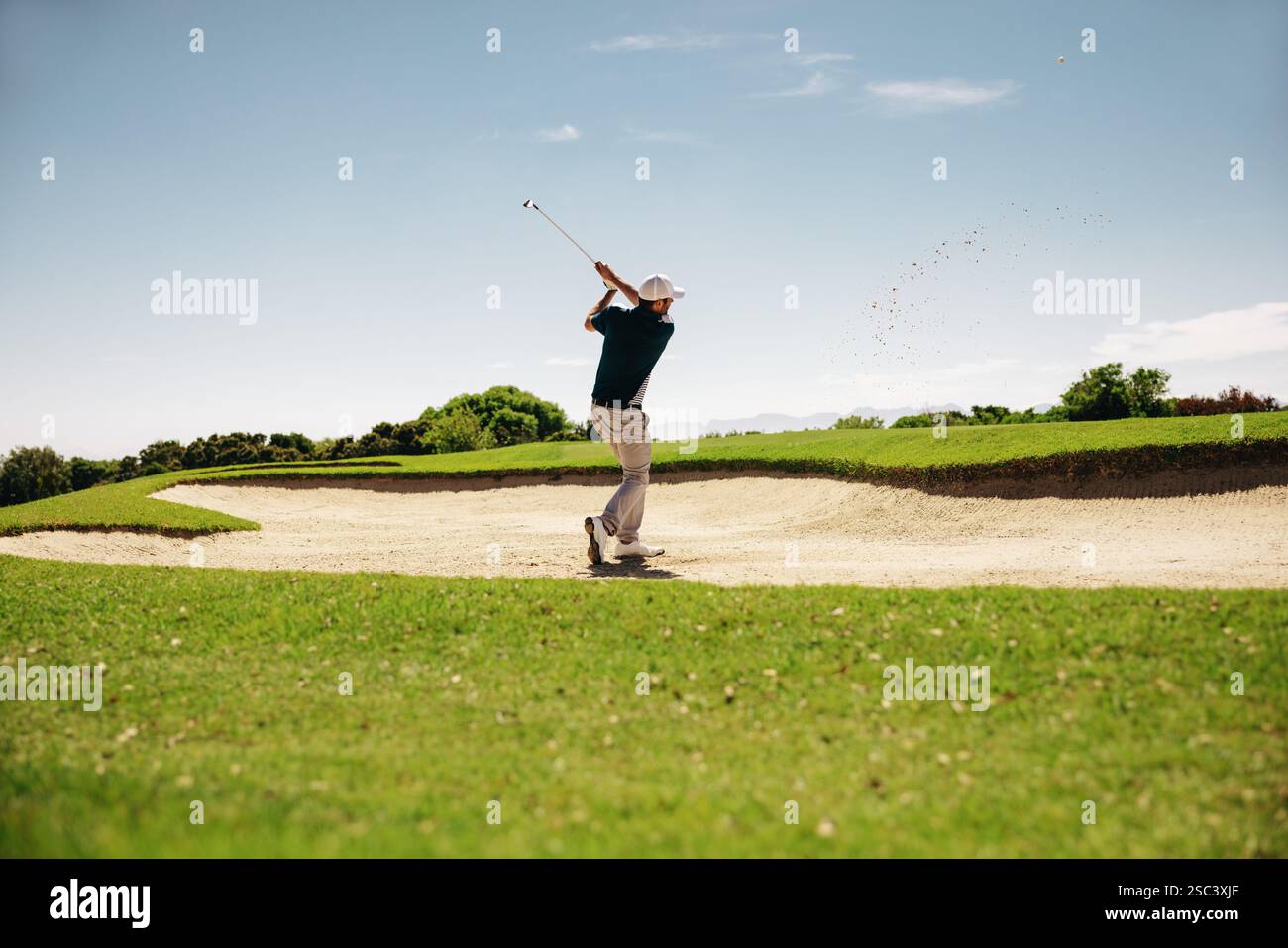 A man golfer demonstrates exceptional technique and focus during a ...