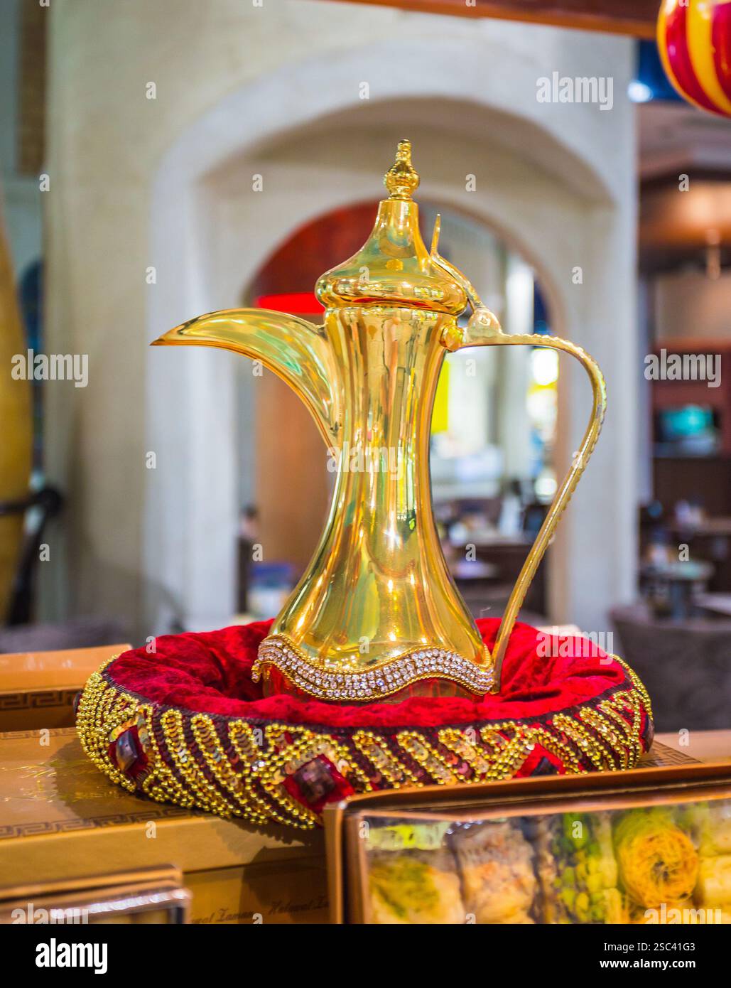 row of shiny traditional coffee pots at the souq in Dubai Stock Photo ...
