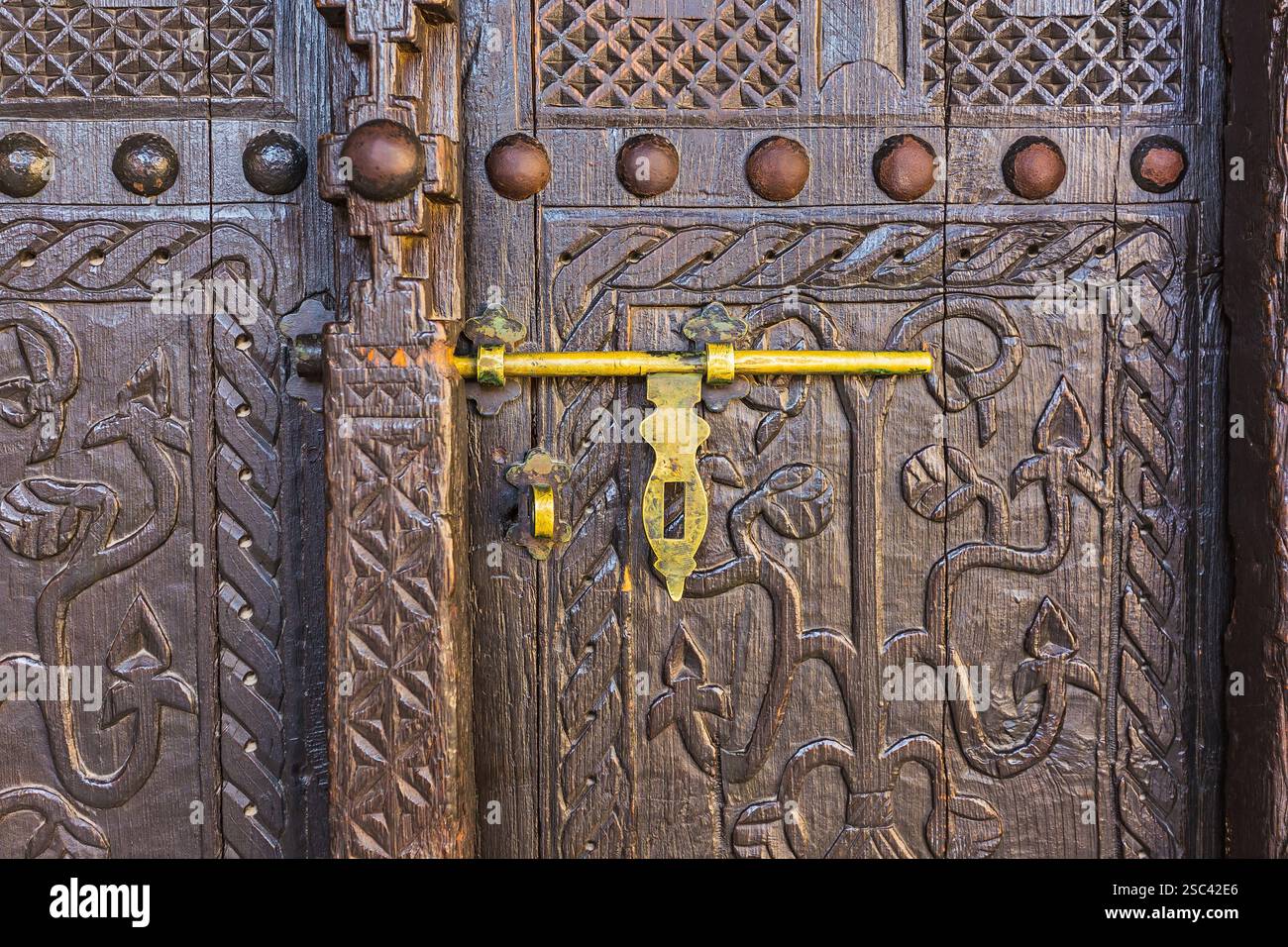 old lock on a wooden carved door Stock Photo - Alamy