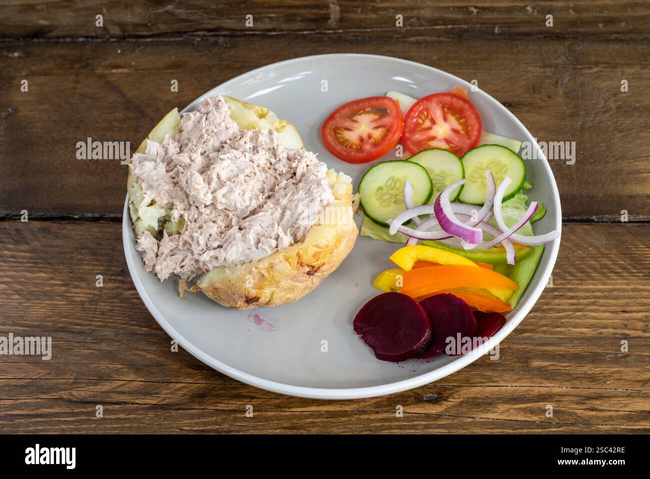 Jacket Potato and Tuna Mayo served with a side salad Stock Photo - Alamy