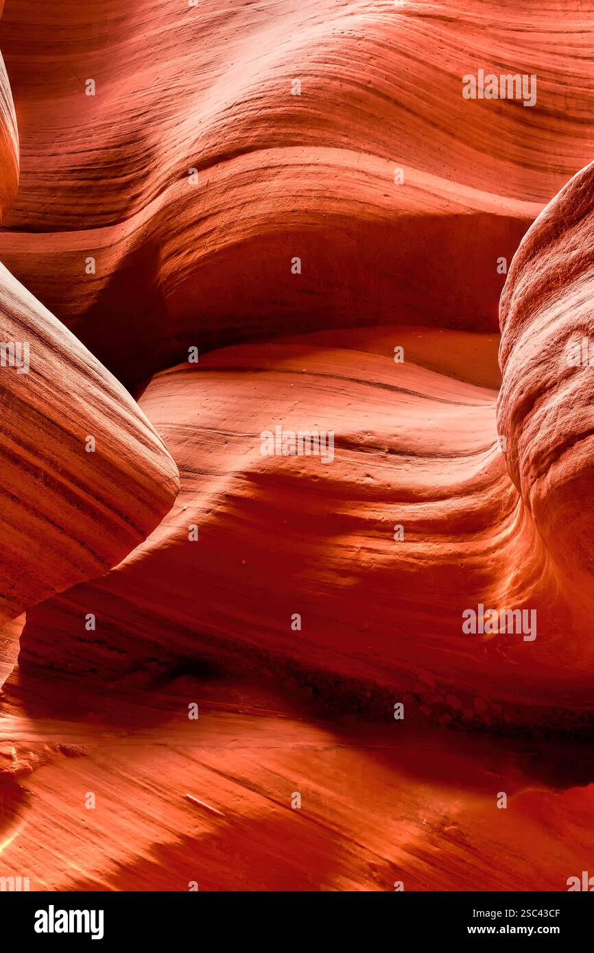 A red rock formation with a lot of texture. The rock is very rough and ...