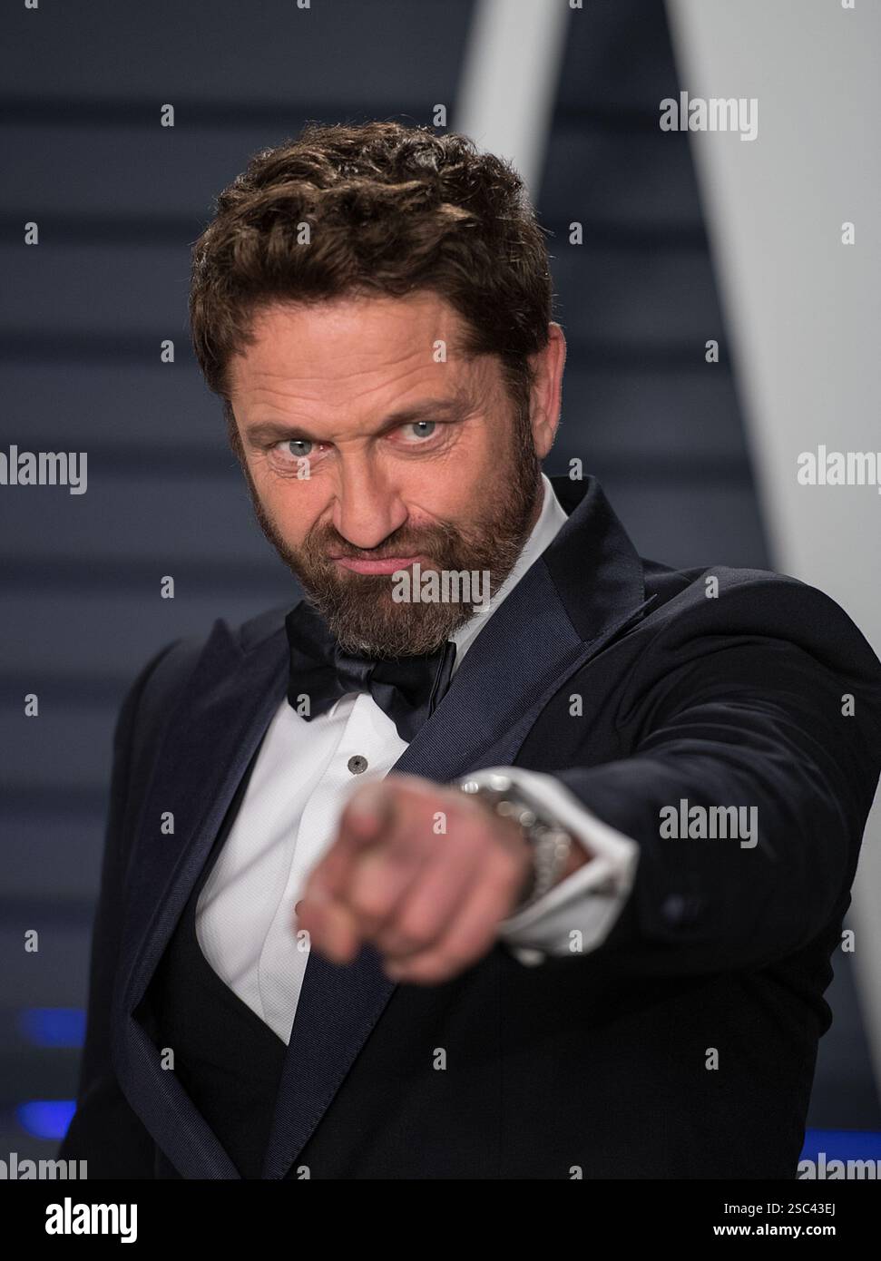Gerard Butler arriving at the 2019 Vanity Fair Oscar Party at the ...