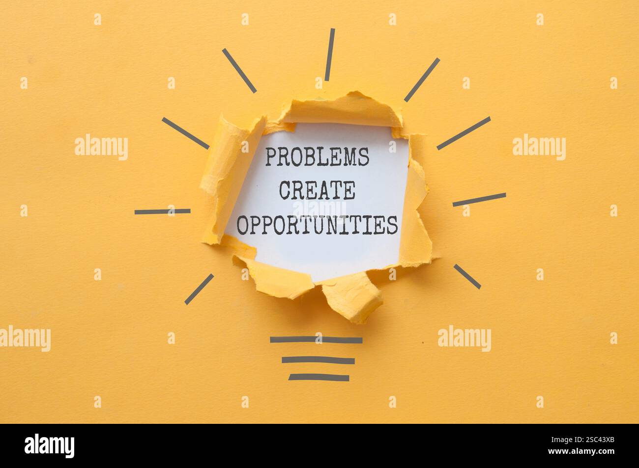 Problems create opportunities revealed under torn paper with light bulb ...
