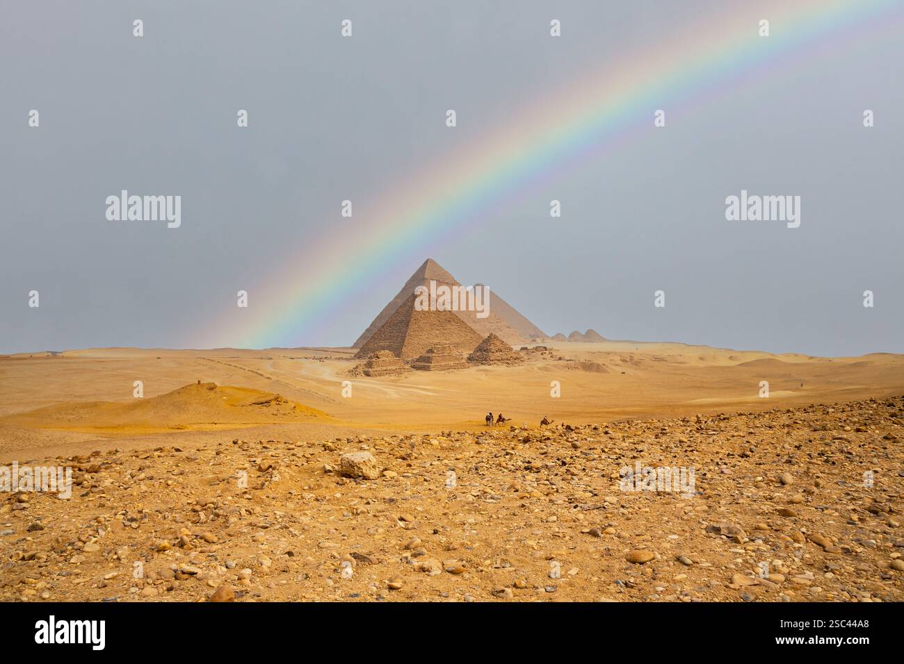 Egypt. Cairo - Giza. Rainbow over the pyramids. General view of ...