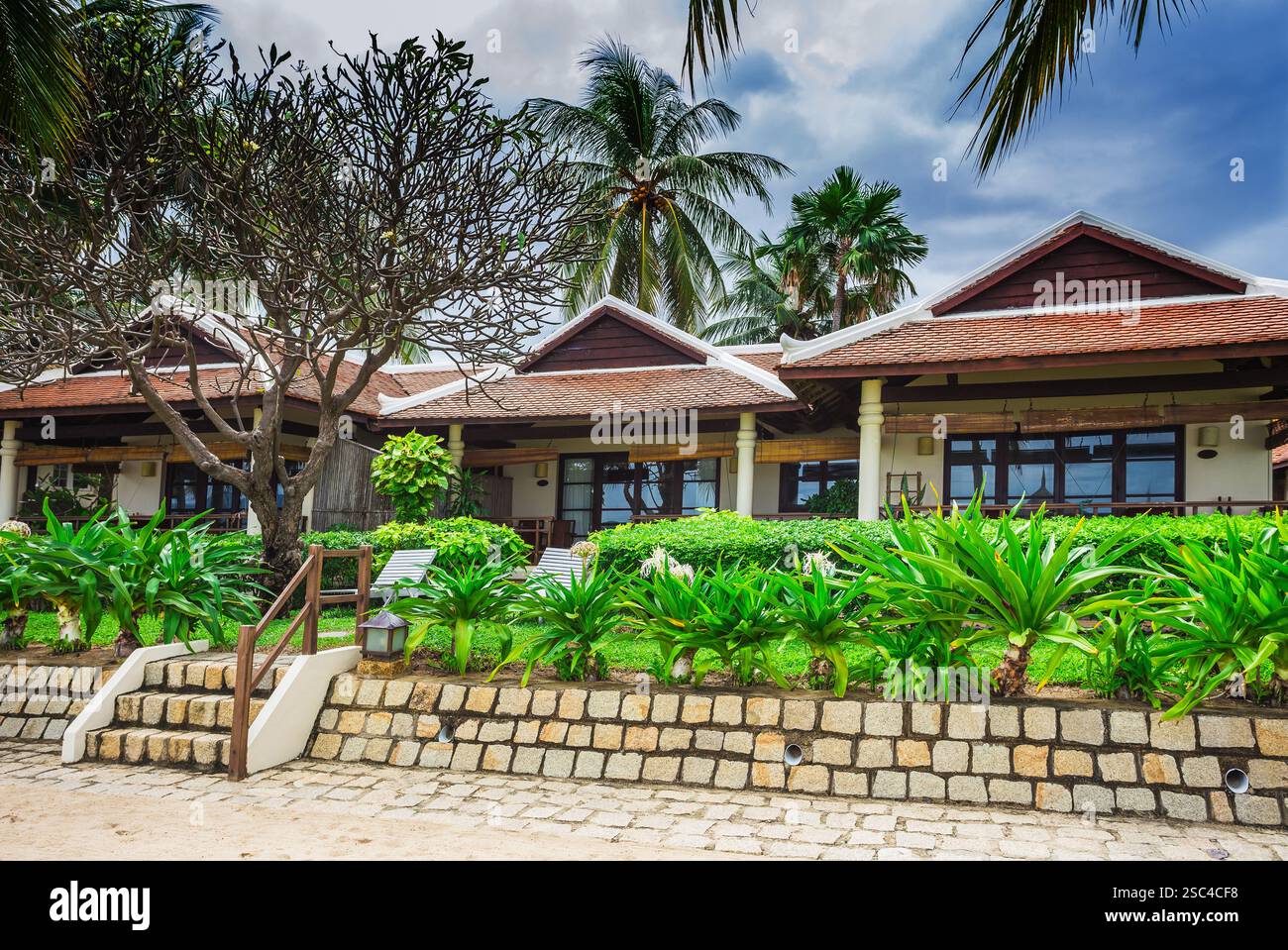guest houses among palm trees, Southern Vietnam Stock Photo - Alamy