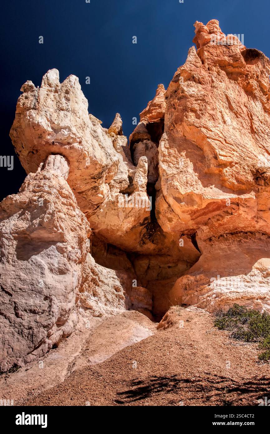 A rocky mountain with a small hole in the middle. The hole is ...