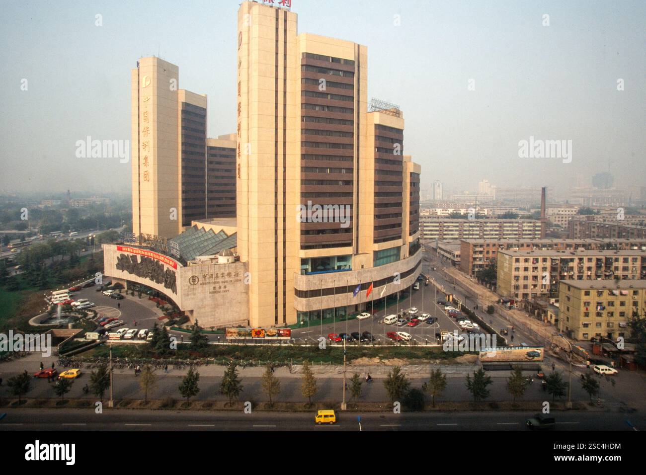 A tall, modern building in Beijing with surrounding urban ...