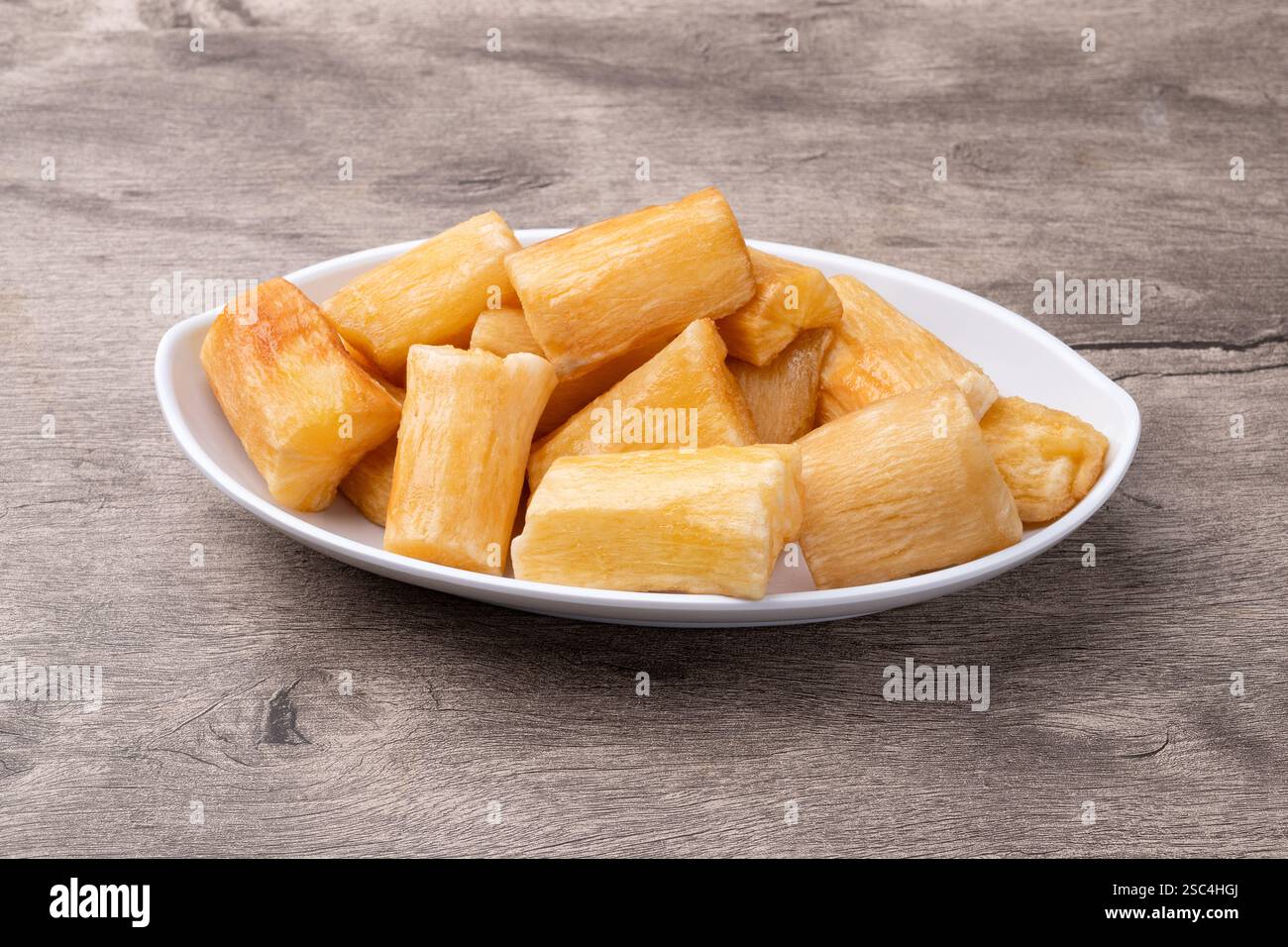 Traditional brazilian fried manioc in a plate over wooden table Stock ...