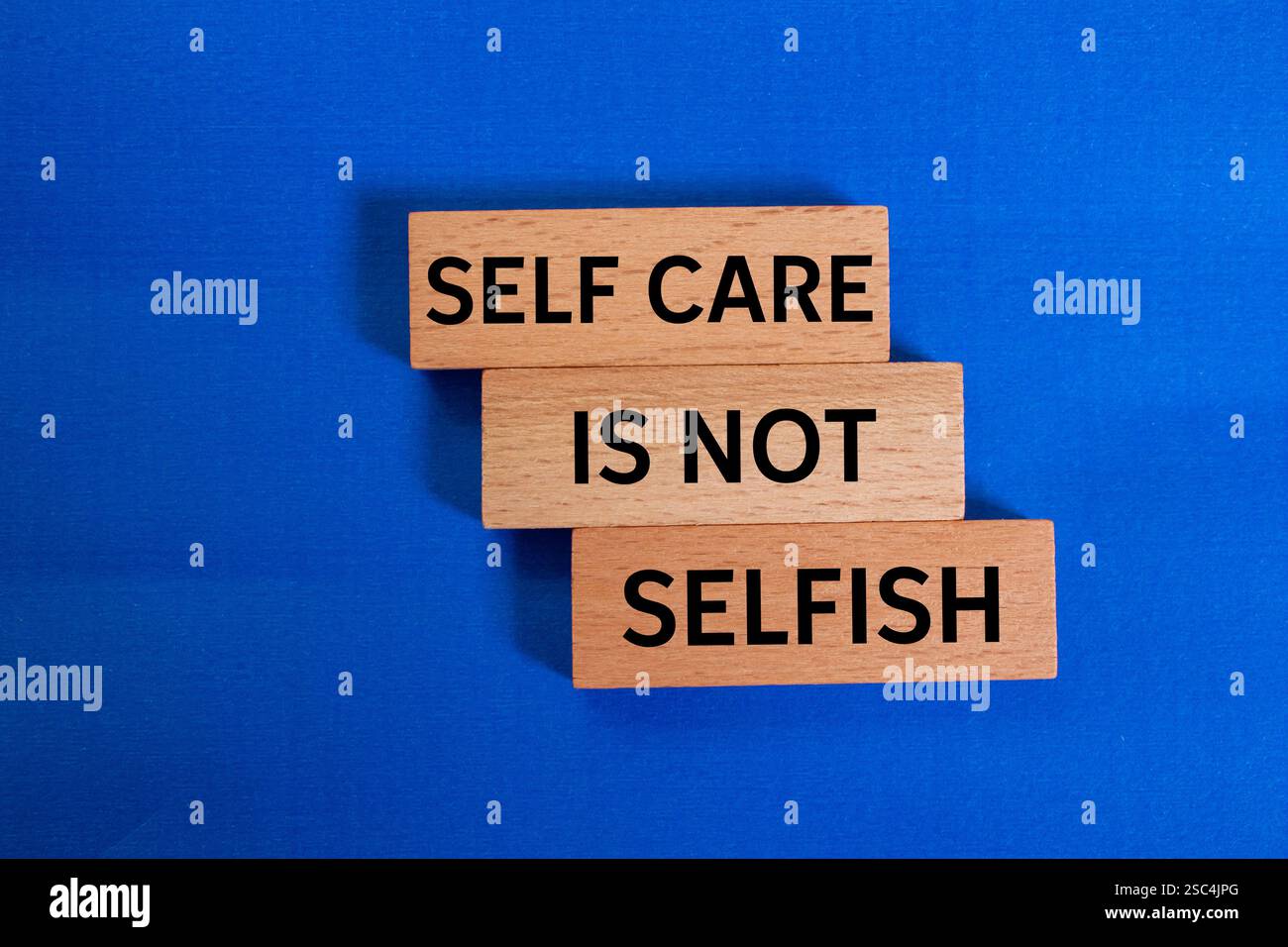 Self care is not selfish message written on wooden blocks on blue ...