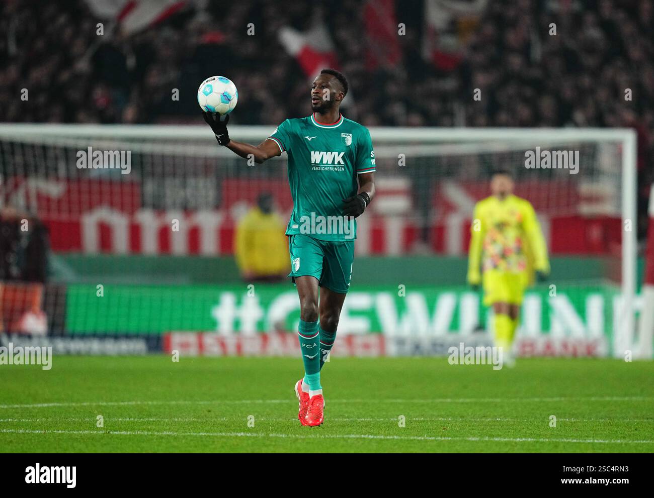 February 04 2025: Chrislain Matsima of FC Augsburg controls the ball ...