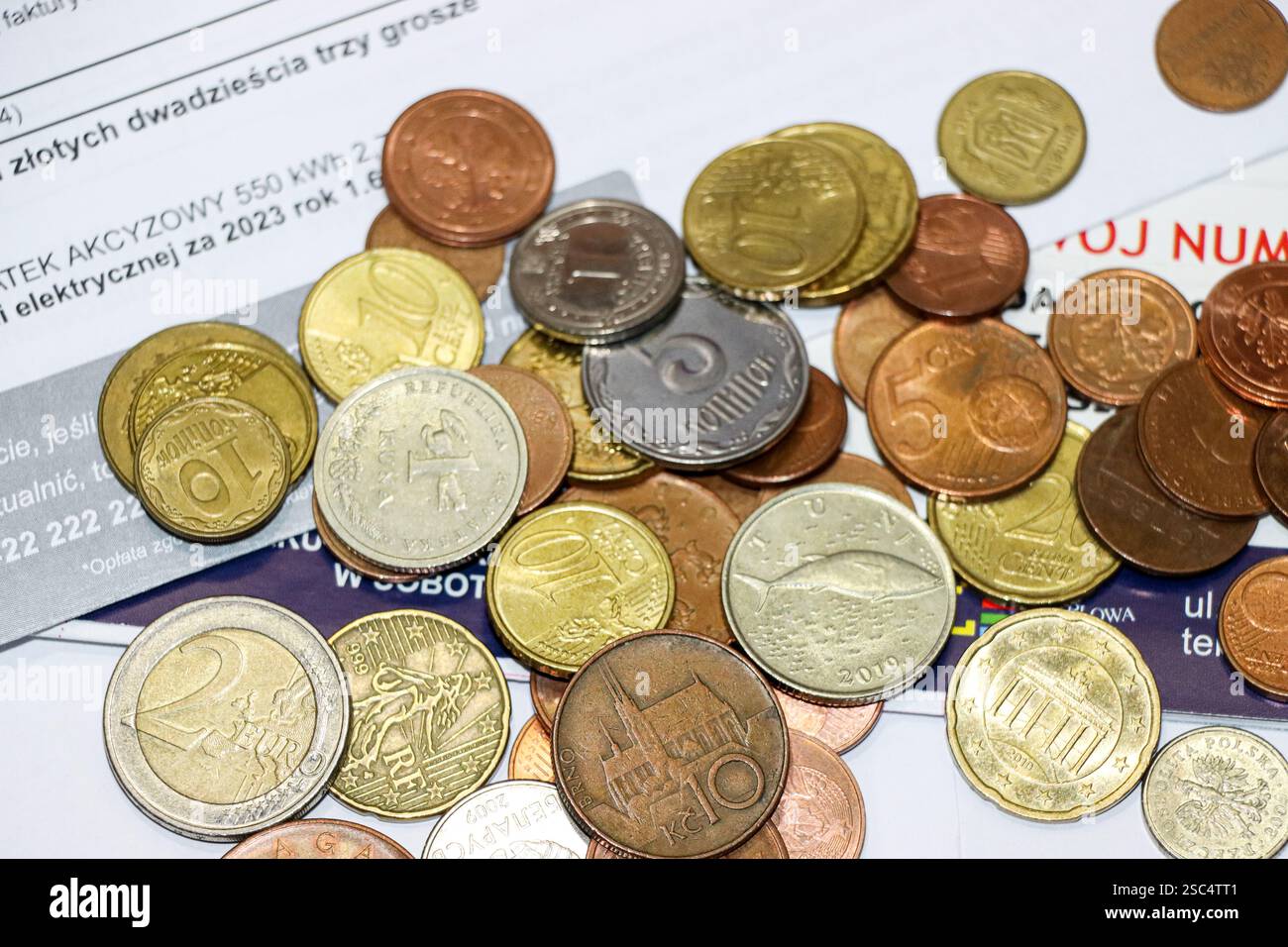 Coins from different countries on a table Stock Photo - Alamy