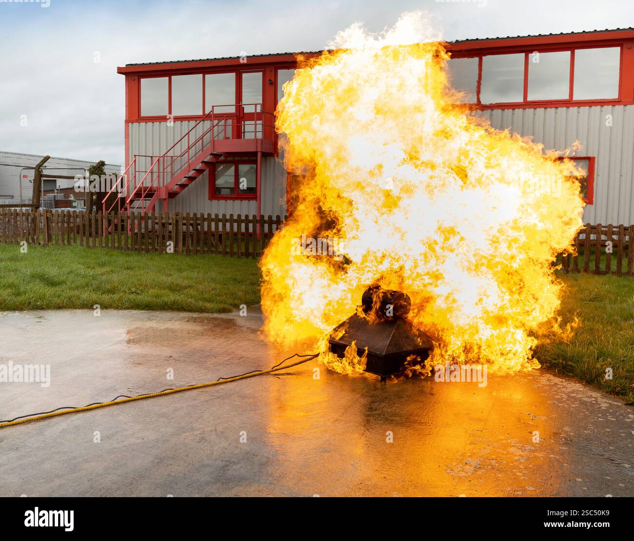 Training staff to use fire extinguishers safely Stock Photo - Alamy