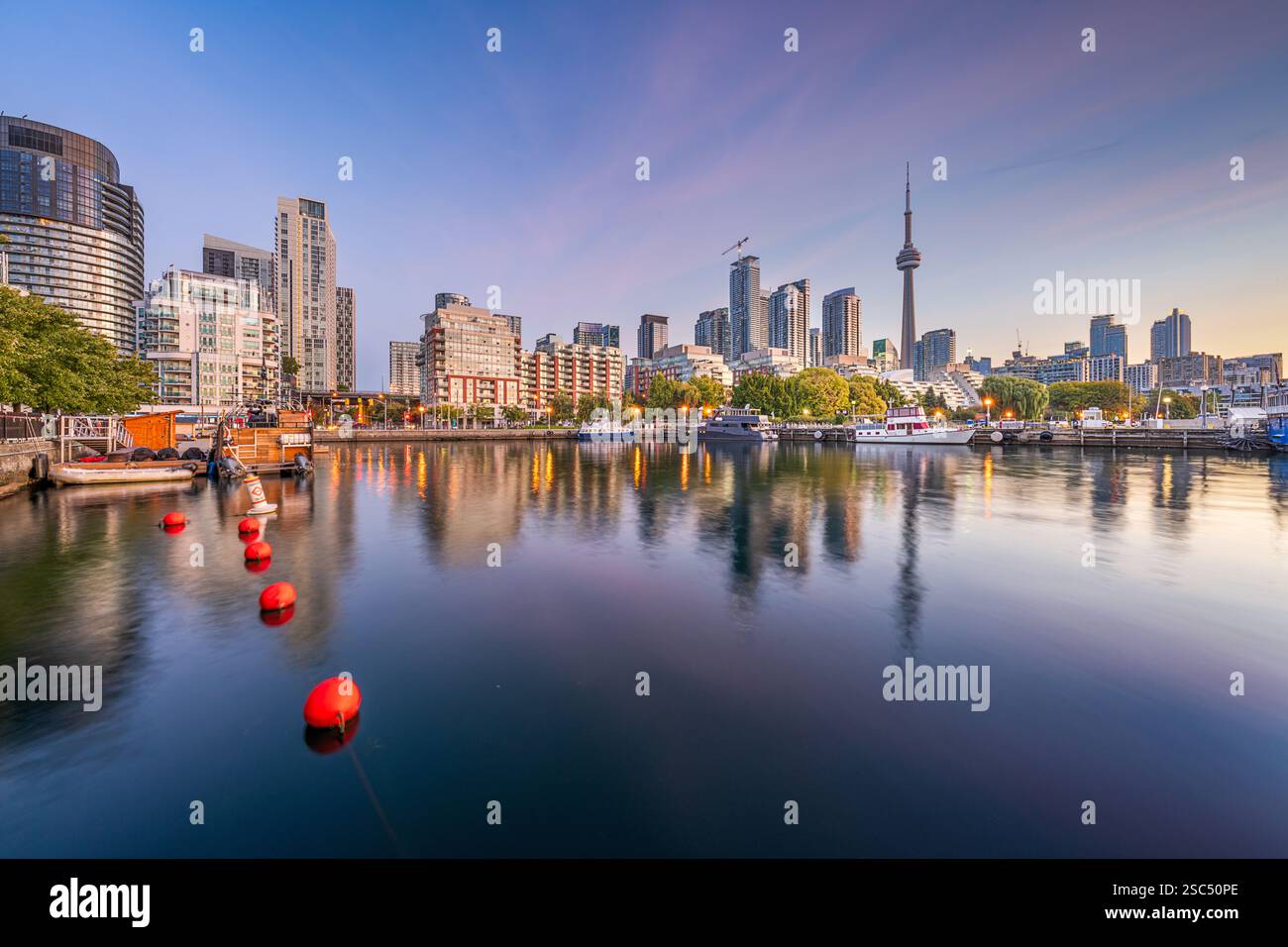 Toronto, Canada city skyline with Harbourfront at dawn on Lake Ontario ...