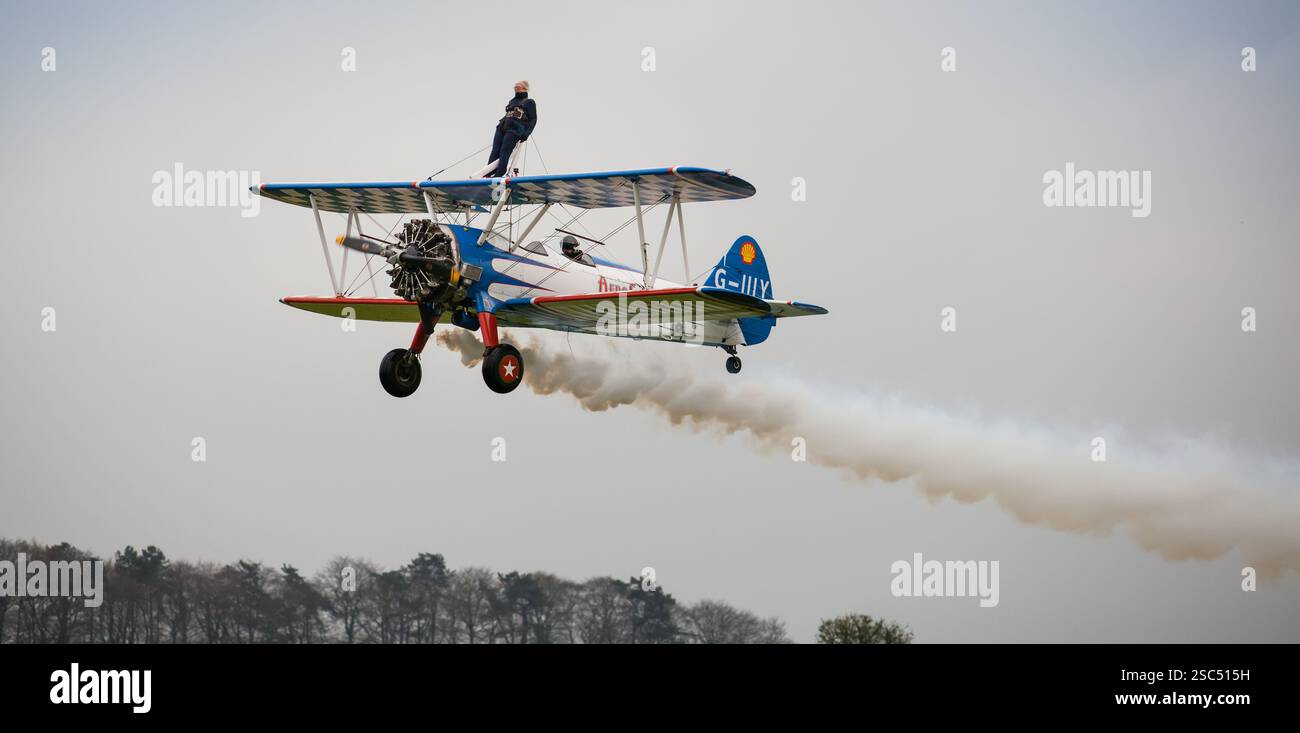 Aerobatic wing walking in Rencomb, The Cotswolds, England Stock Photo ...