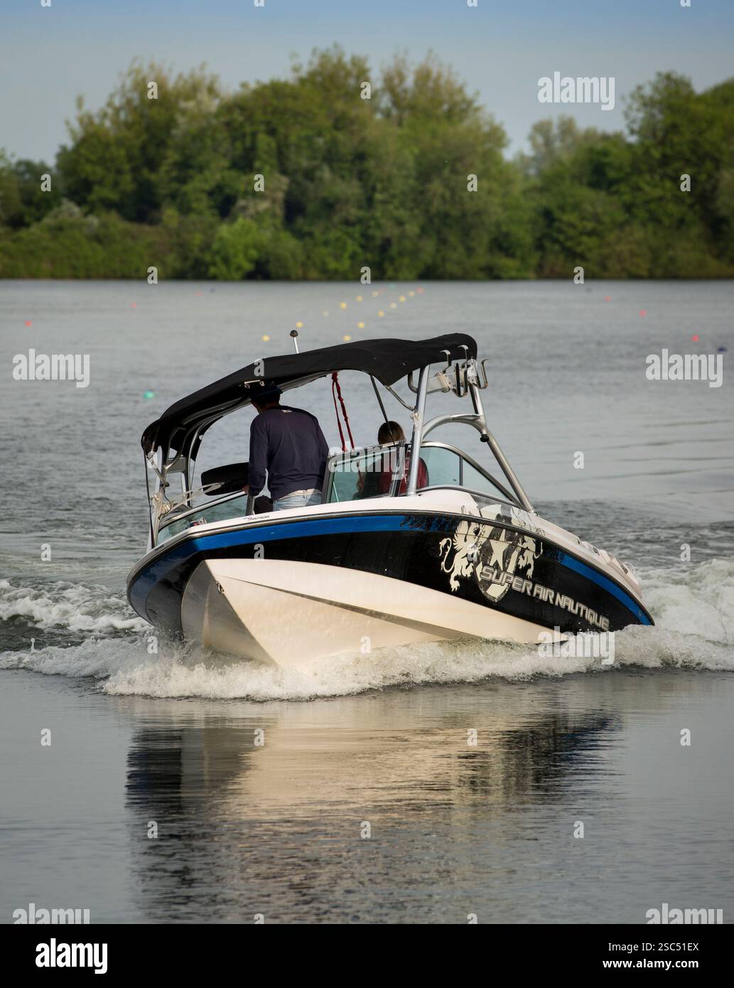Wakeboarding behind a boat in The Cotswold Water Park, England Stock ...
