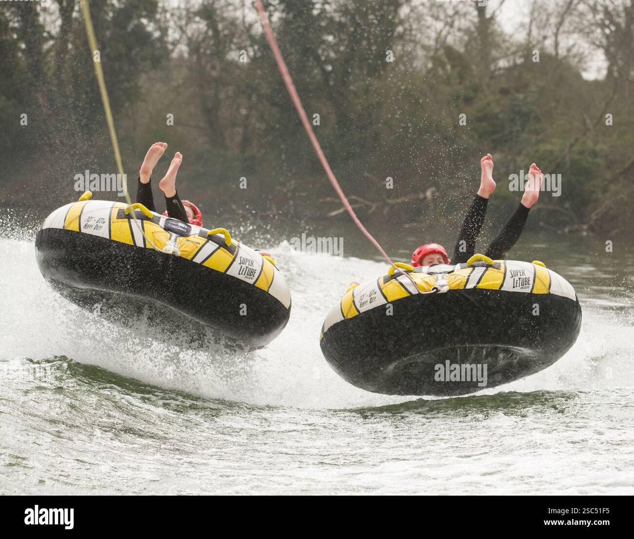Inflatable being towed behind a boat in The Cotswold Water Park Stock ...