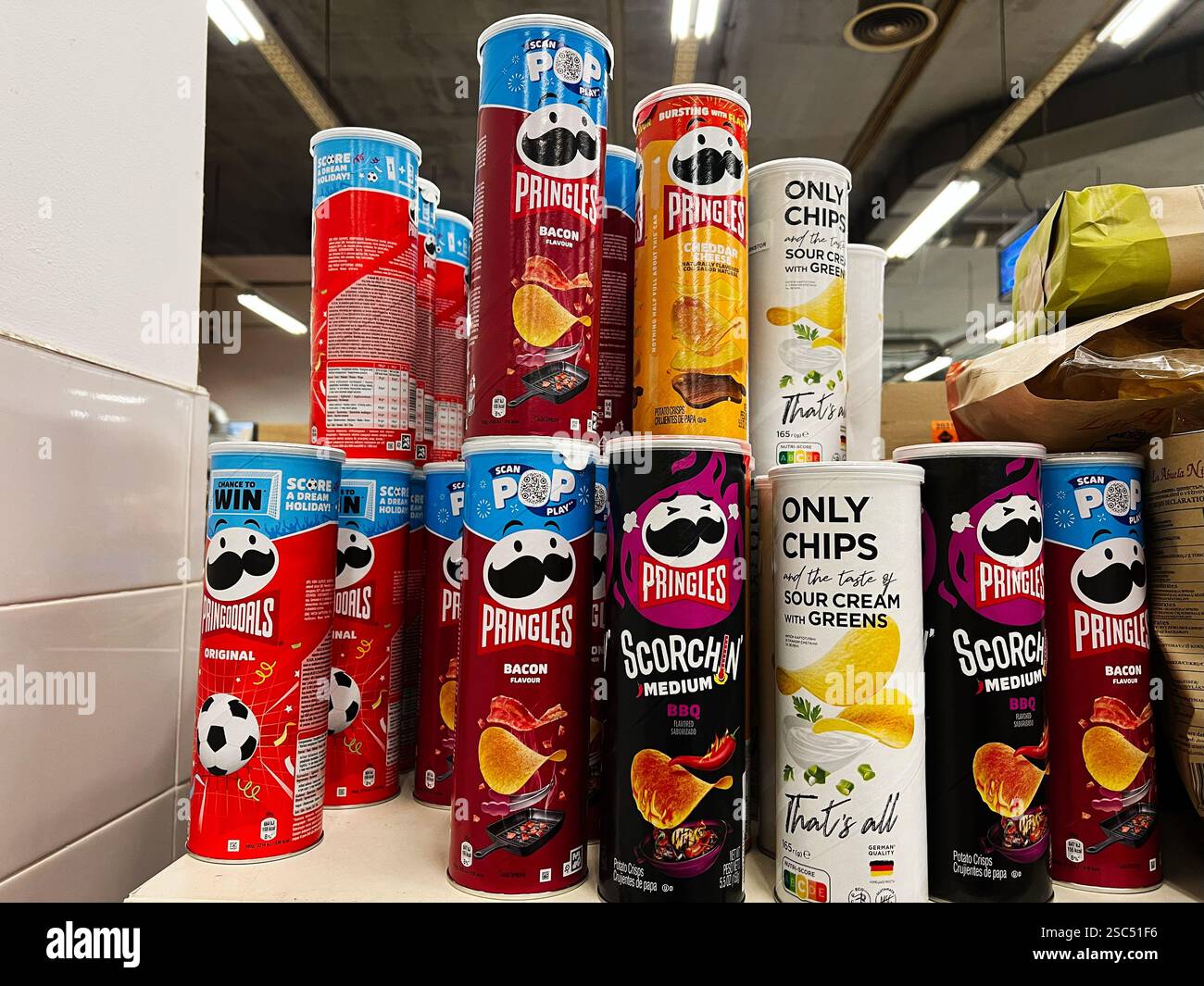 Kyiv, Ukraine - February 04, 2025: An assortment of chips canisters in ...