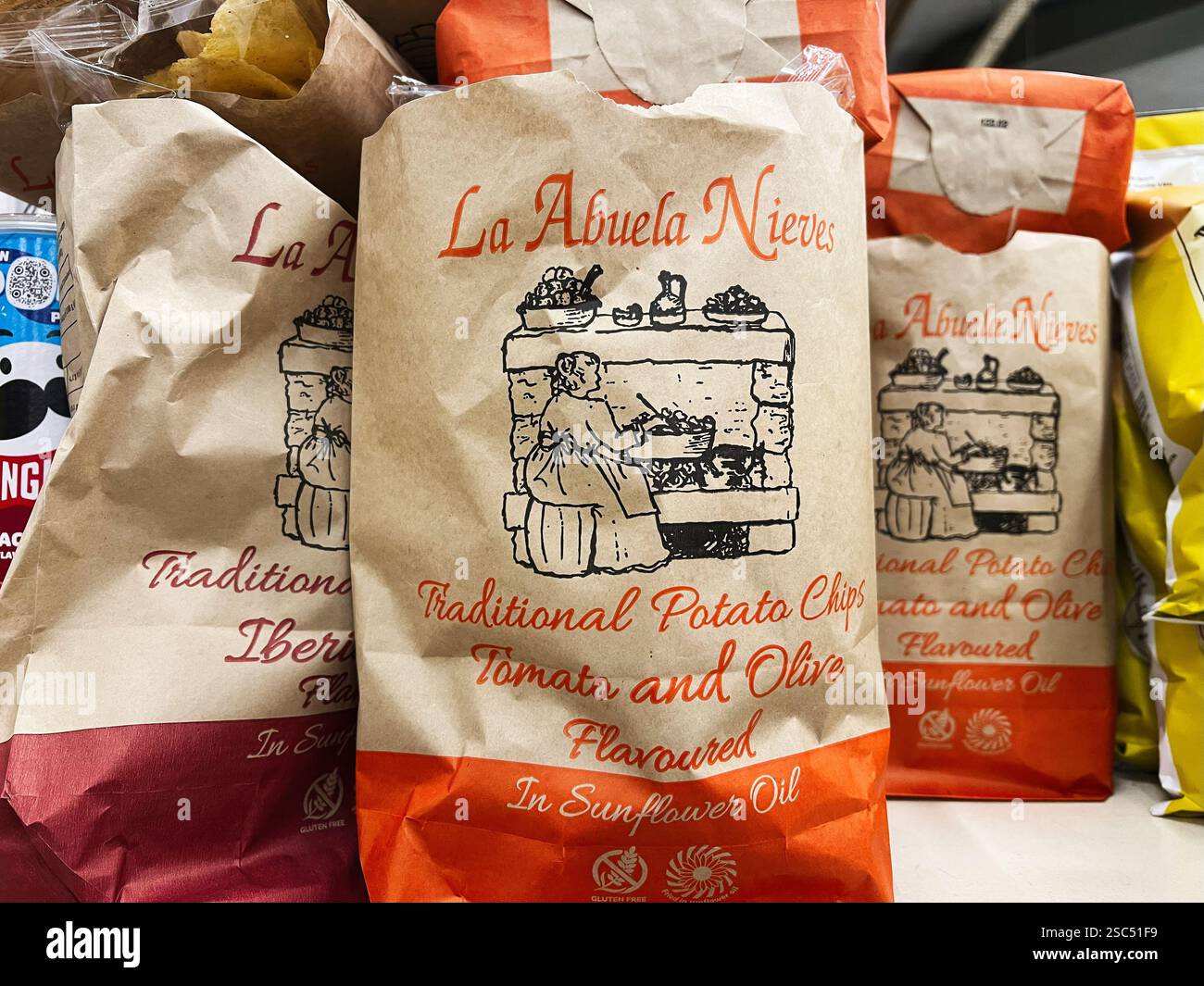 Kyiv, Ukraine - February 04, 2025: Rustic-style chips bags with ...