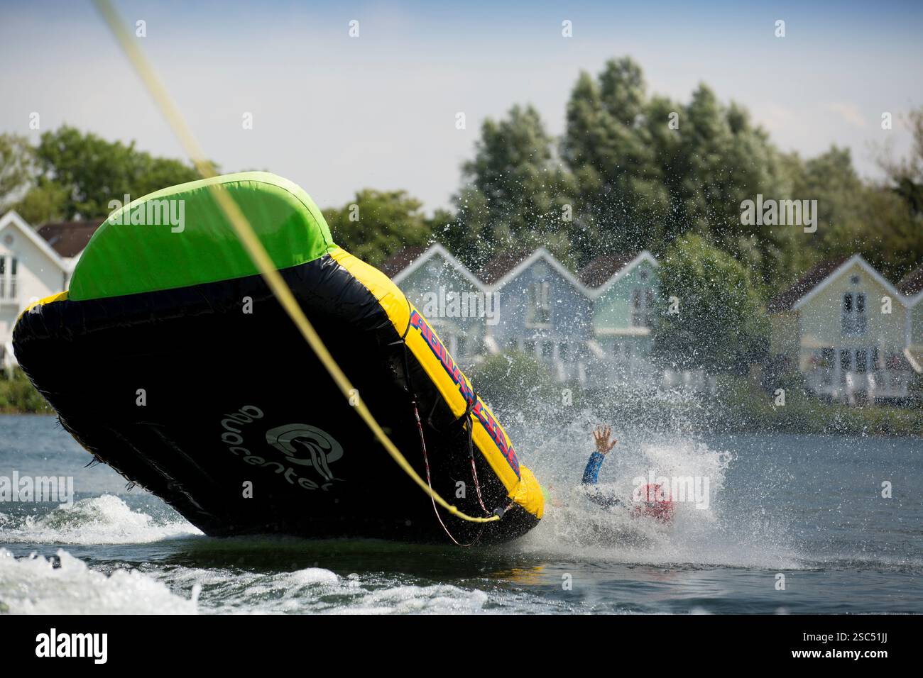 Inflatable being towed behind a boat in The Cotswold Water Park Stock ...