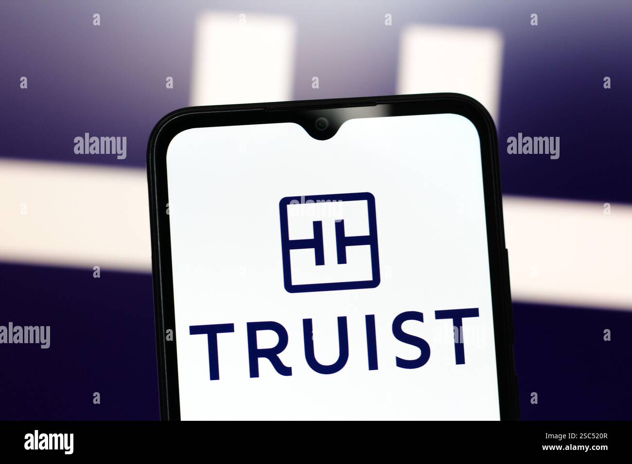 In this photo illustration, the Truist Financial logo is seen displayed ...