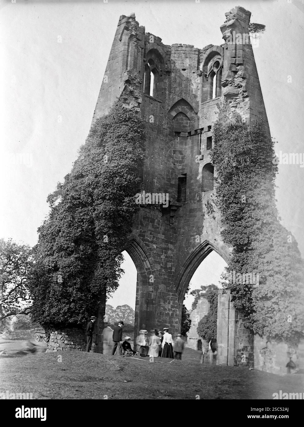 A group of people by the Maxstoke Priory, an Augustinian priory founded ...