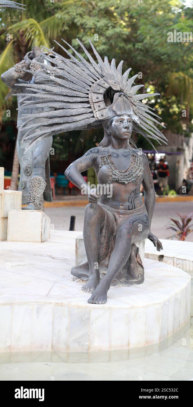 One seating female Mayan character with a feather headdress represented ...