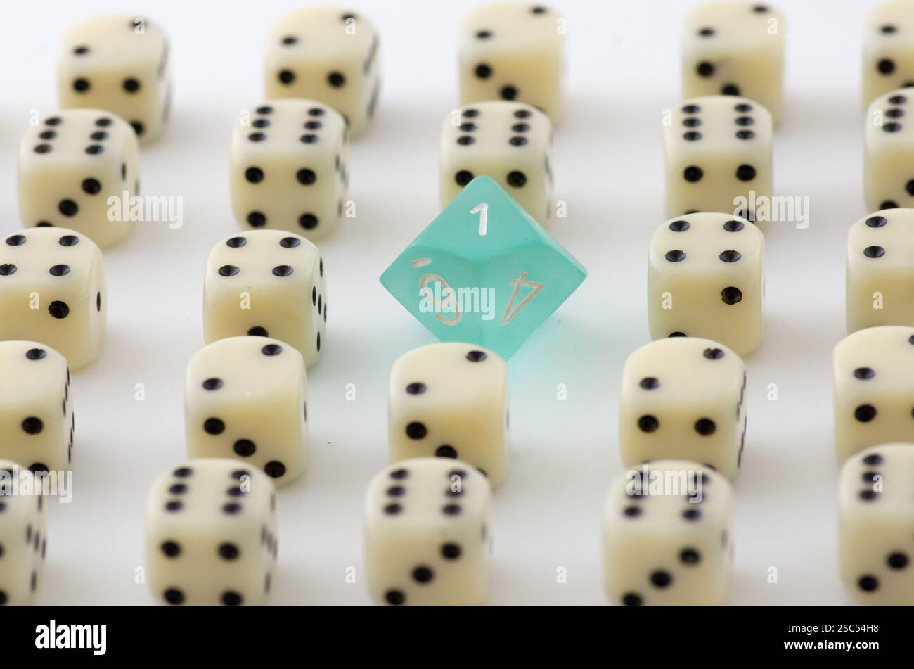 A bright blue ten-sided die stands out among a grid of uniform white dice, symbolizing ...