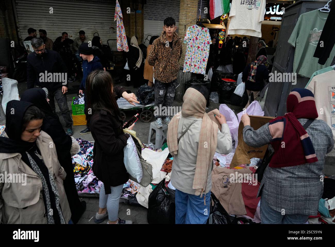 People shop at the old main bazaar of Tehran, Iran, Wednesday, Feb. 5 ...