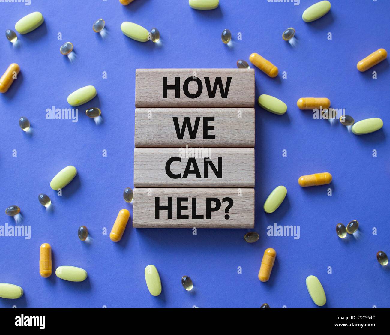How we can help symbol. Concept word How we can help on wooden blocks ...