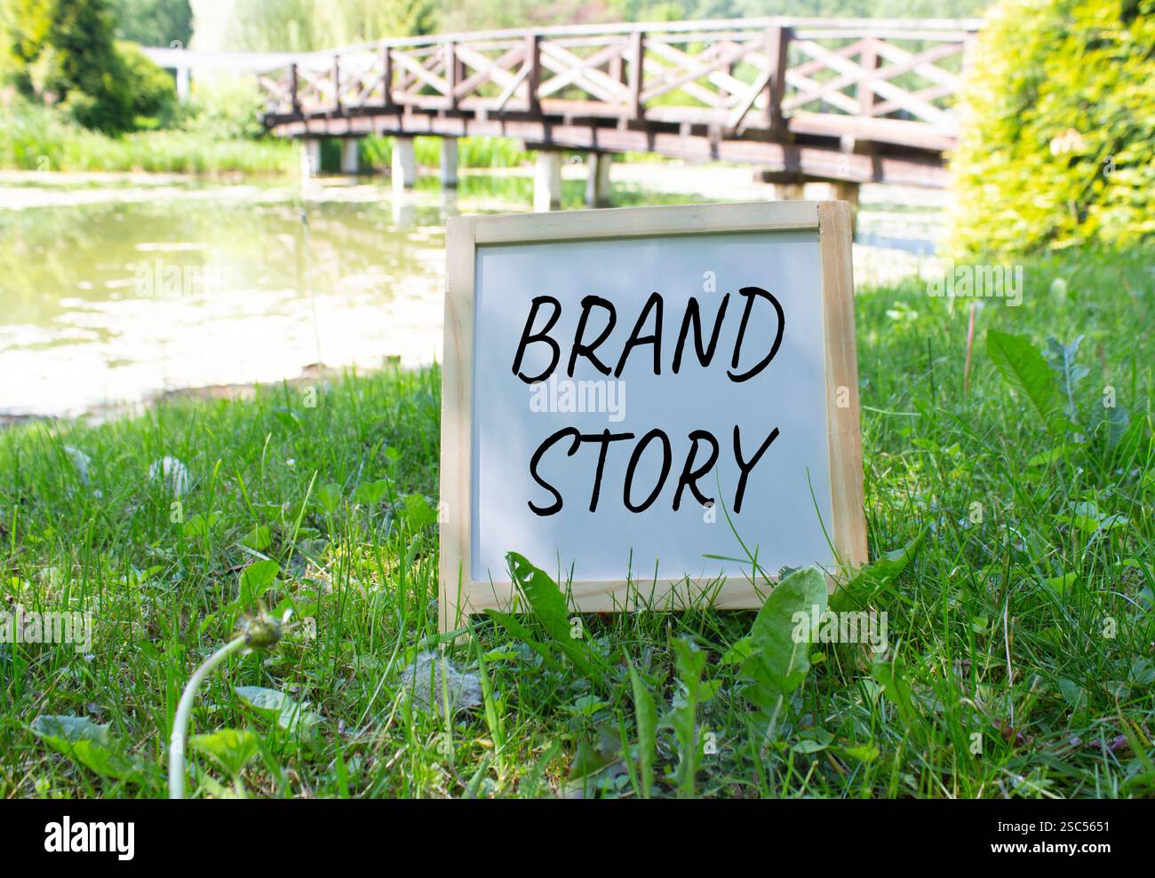 Brand Story symbol. White Blackboard with words Brand Story. Beautiful ...