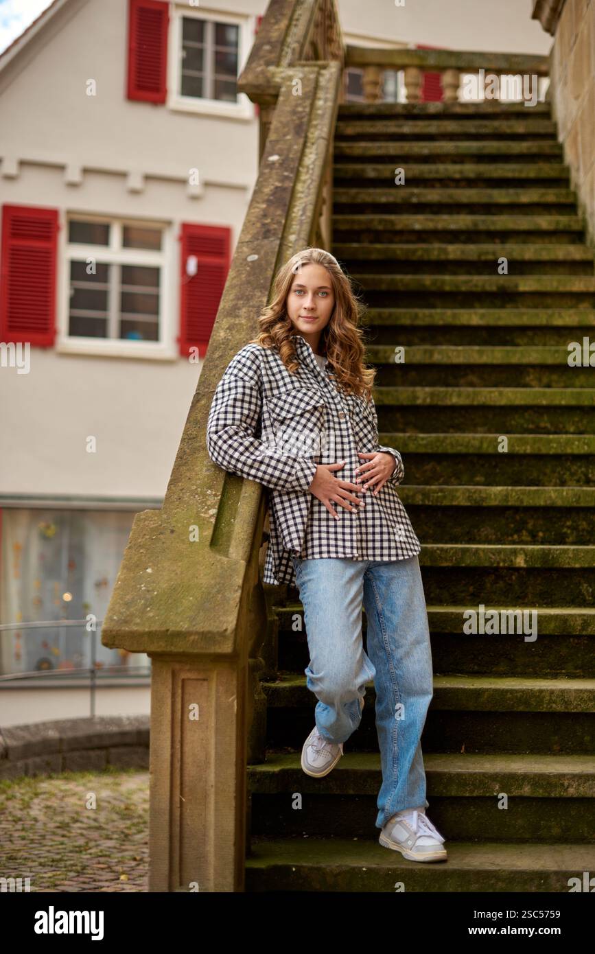 Beautiful Young Woman Flipping Hair in a Lush European Garden with Pink ...