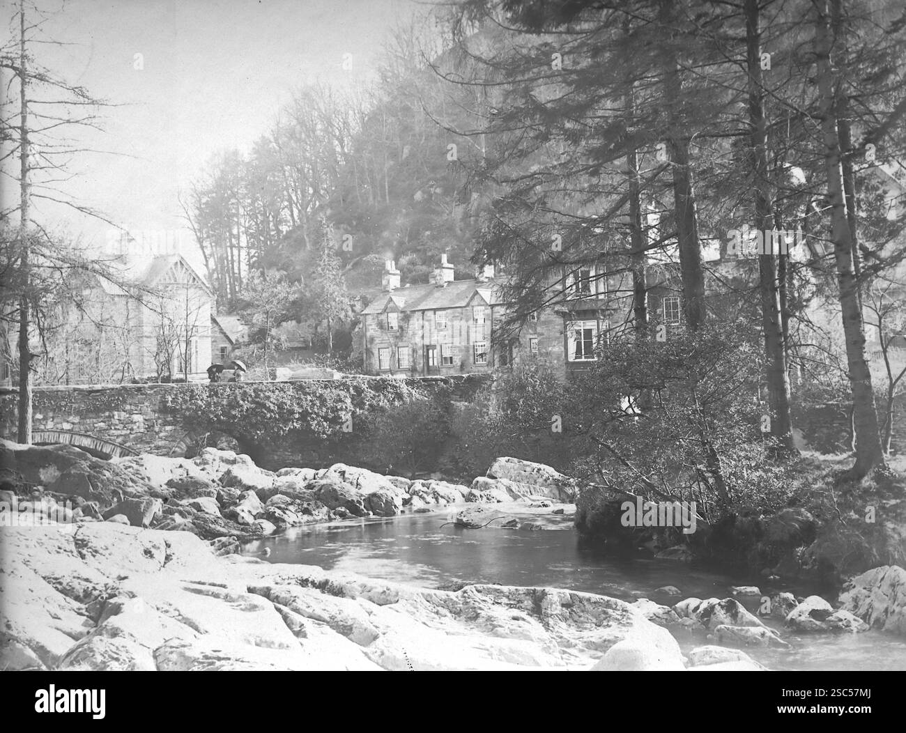 A busy landscape with a bridge over the river (afon) Conwy and large ...