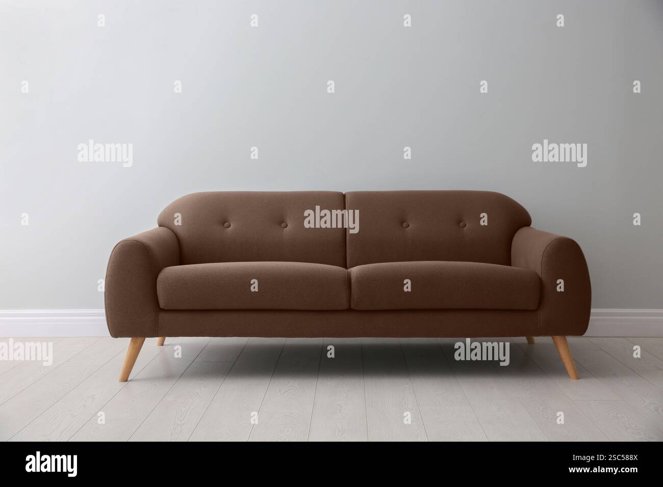 Sofa in mocha mousse shade indoors. Interior with trendy color of 2025 ...